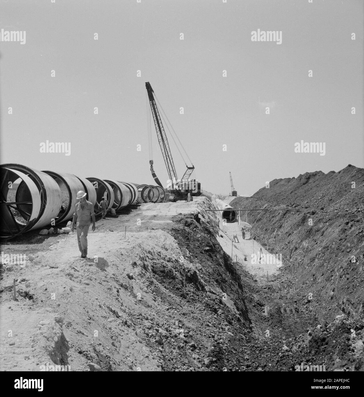 irrigation project in the Negev Desert. Pipes and a dragline at a ...