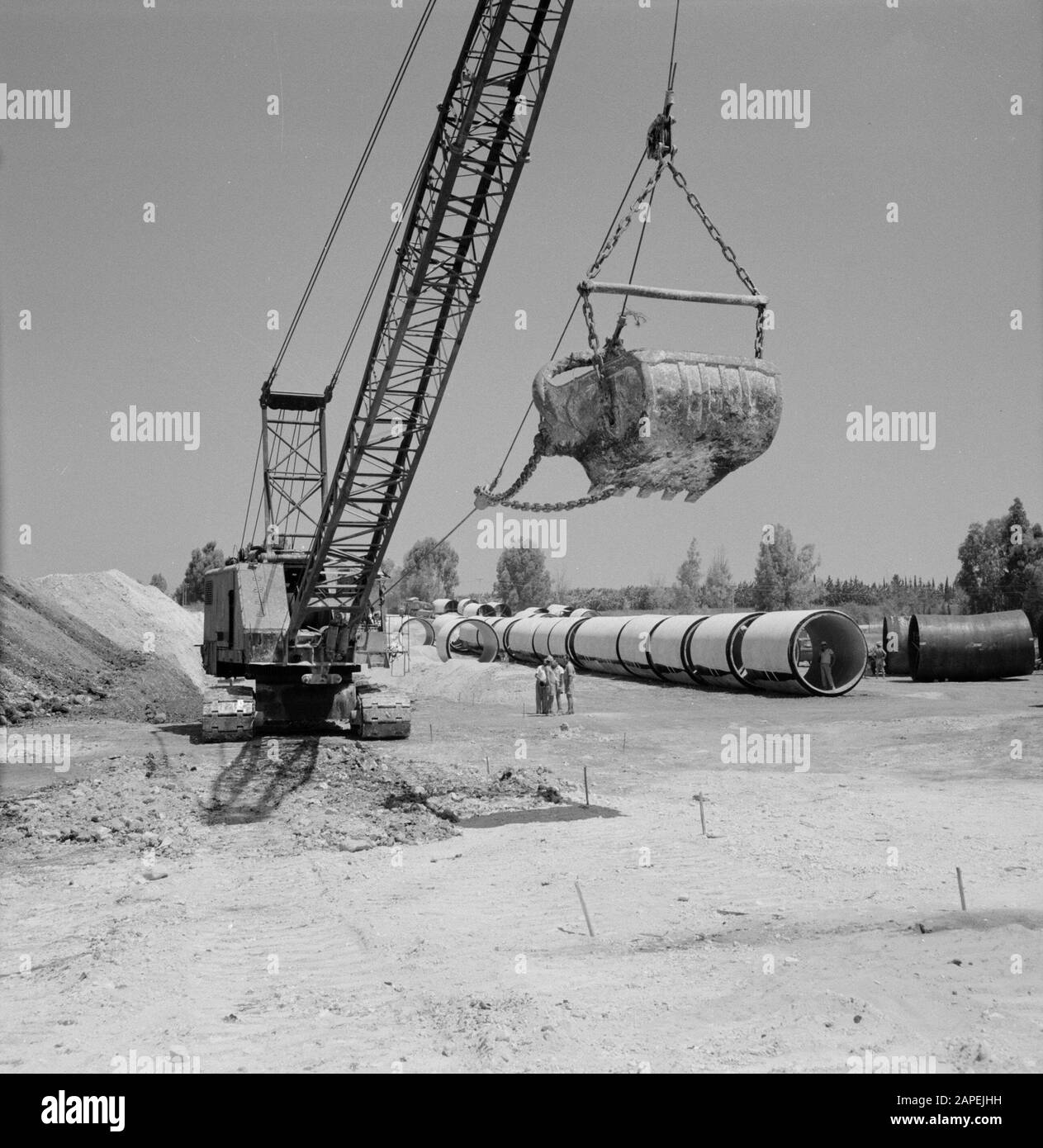 irrigation project in the Negev Desert. Pipes and a dragline at a ...