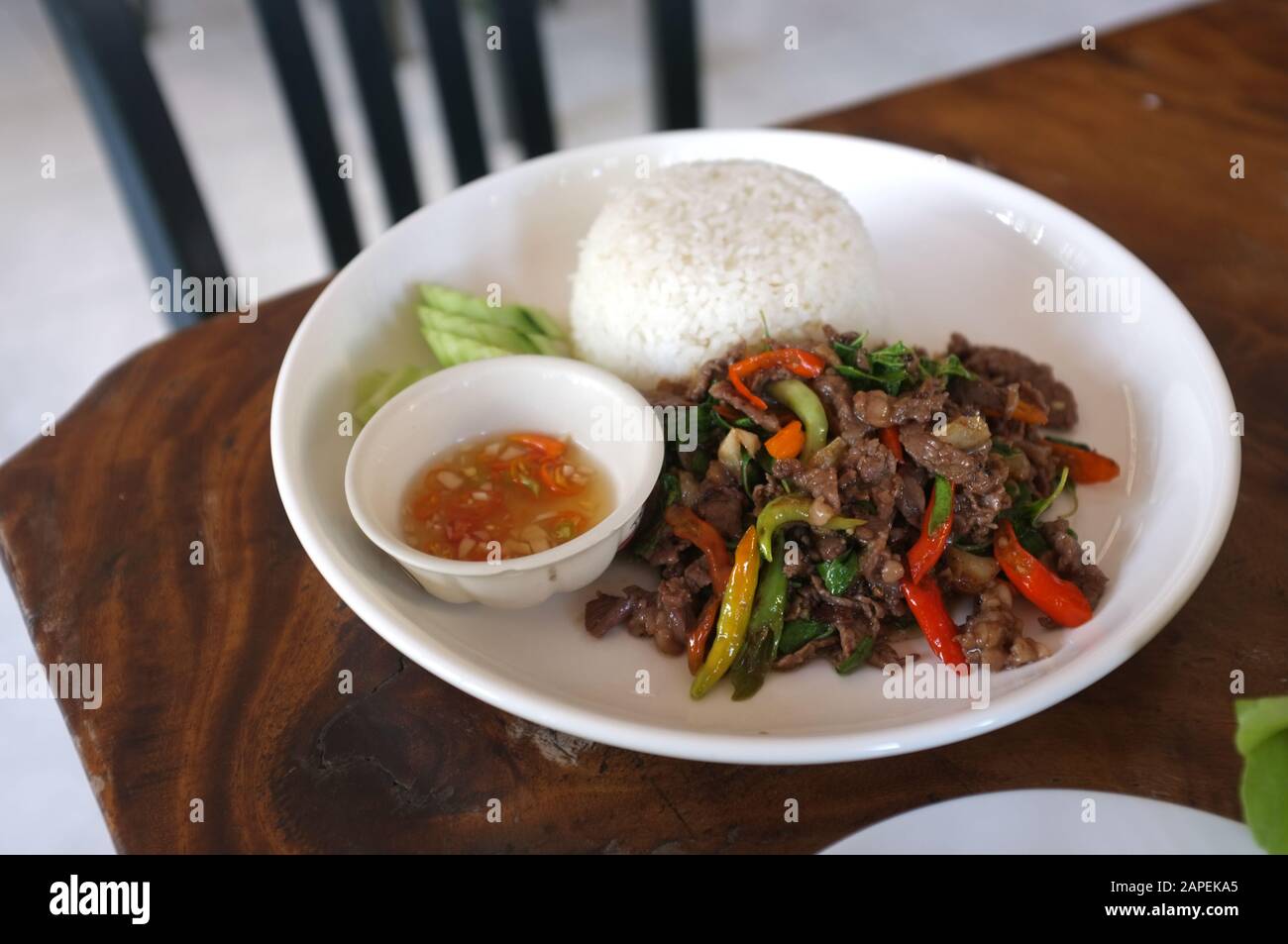 Rice topped with stir-fried beef and basil and fried egg , Concept ...