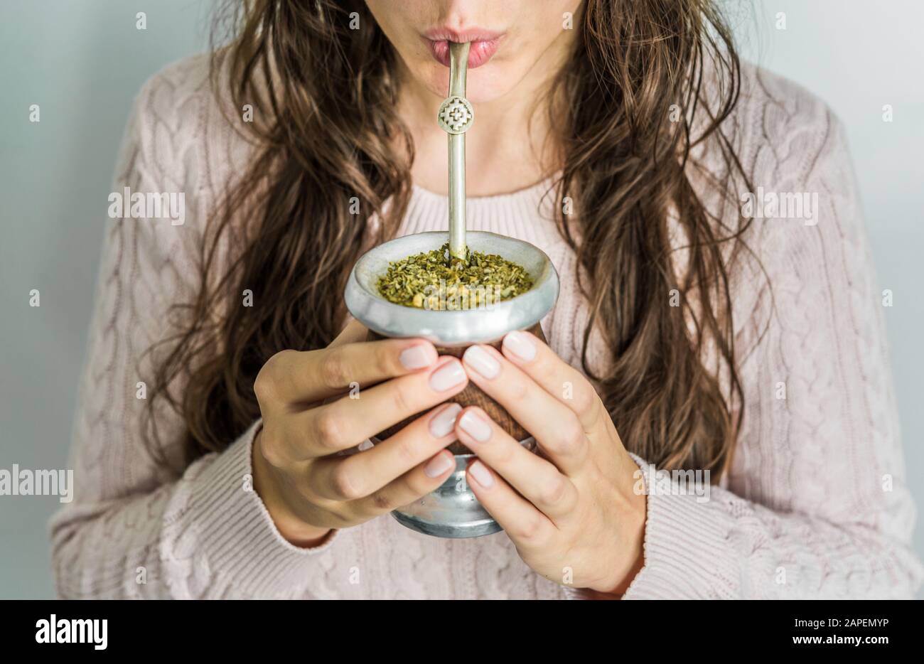 Young woman drinking traditional Argentinian yerba mate tea Stock Photo ...