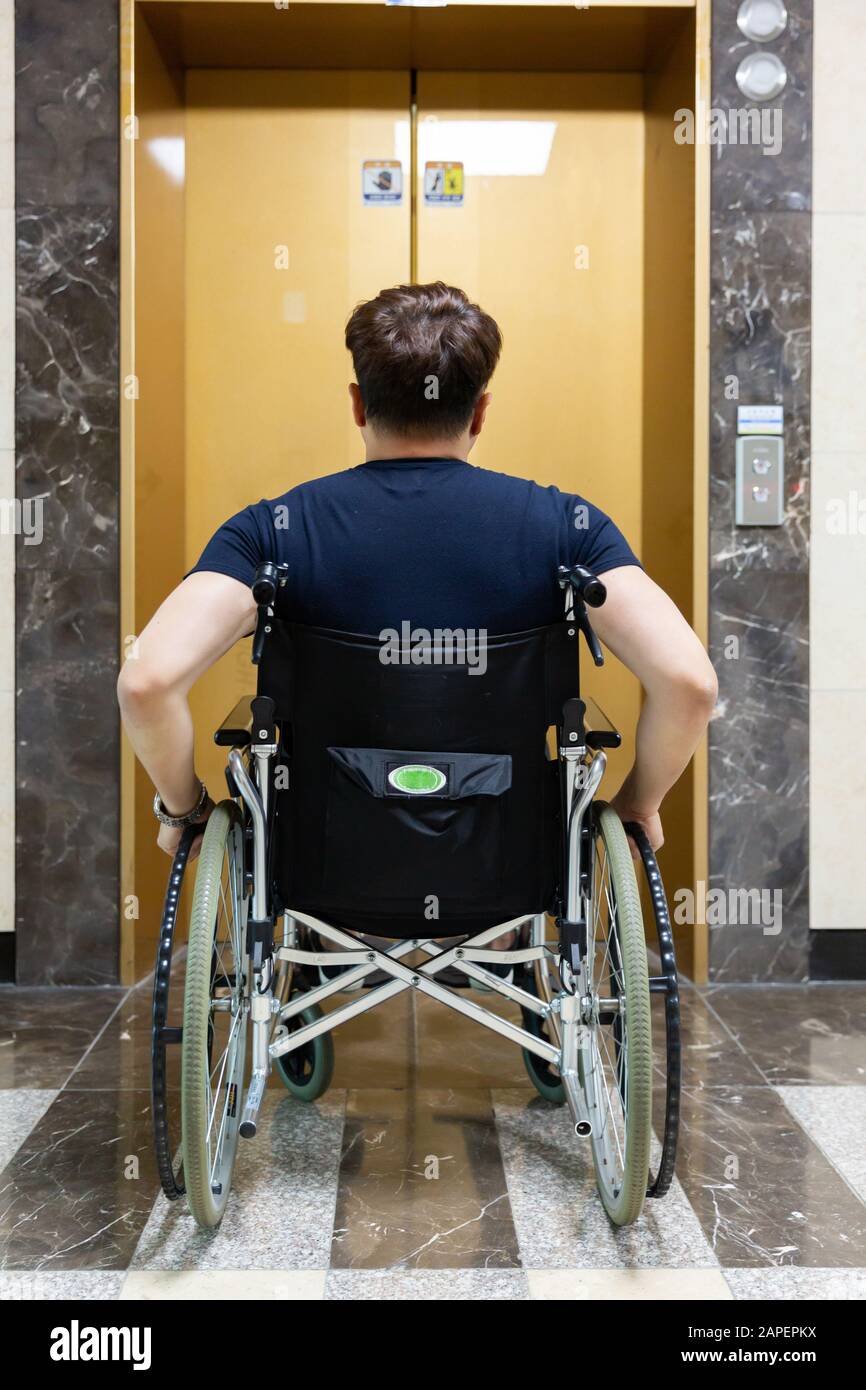 Disabled handicapped man sitting on wheelchair 066 Stock Photo - Alamy