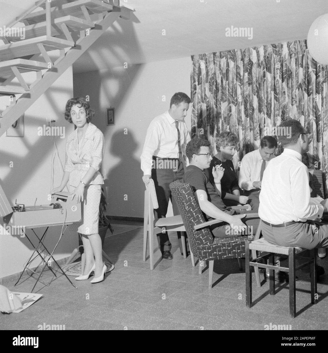 Visitors during a party in a home circle while the hostess is at the ...