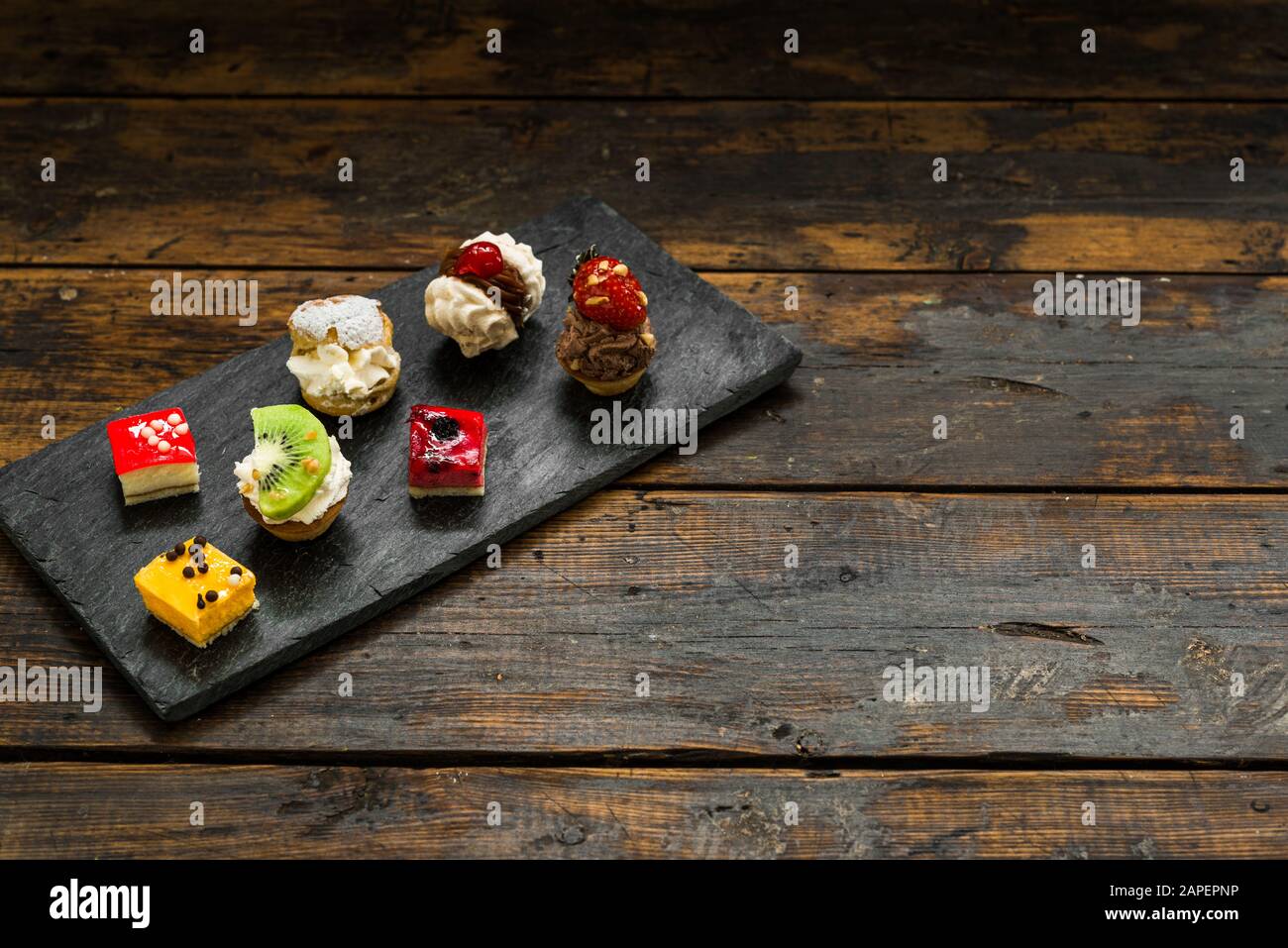 Selection of different dessert pastry sweet mini cakes and tartlets ...