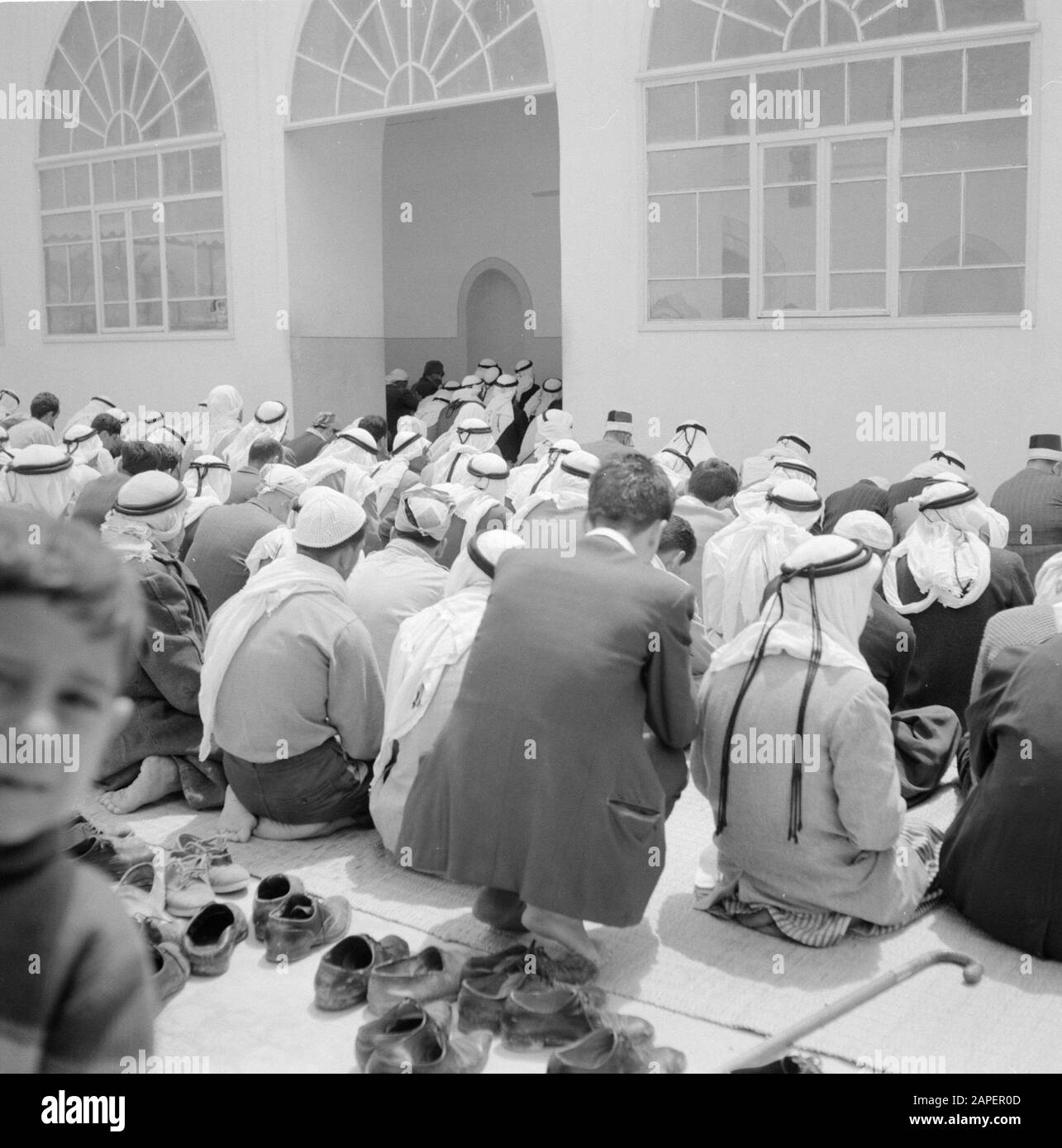 Israel: Nazareth Description: Praying Muslims at a building, presumably ...