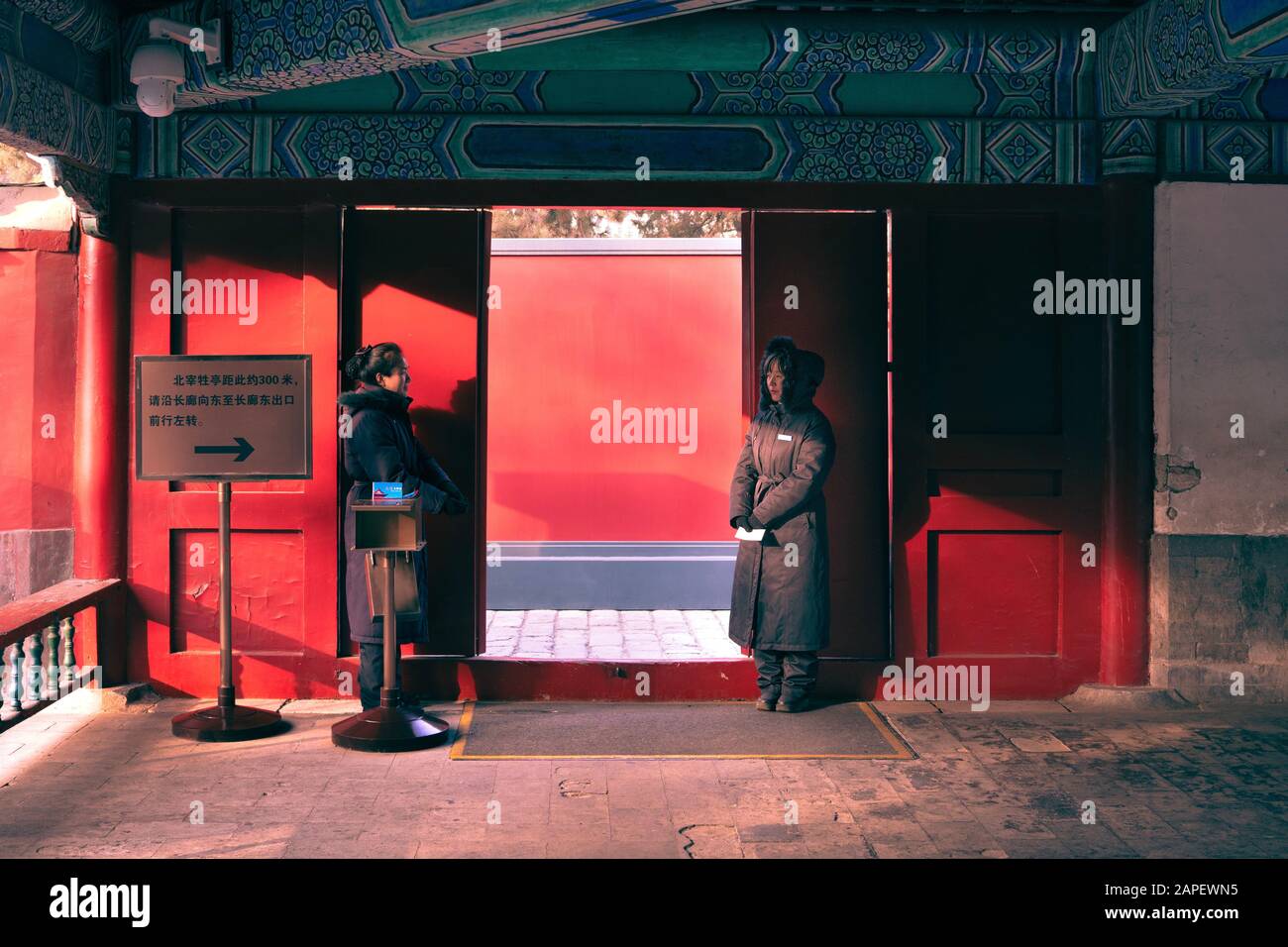 Staff / women in winter guarding an entrance to the Hall of Prayer for ...