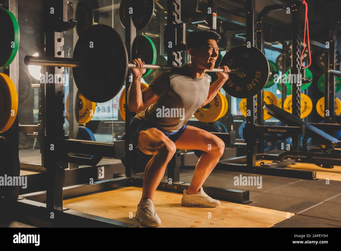 Male and female exercising in gym. Sport, fitness, weightlifting and ...
