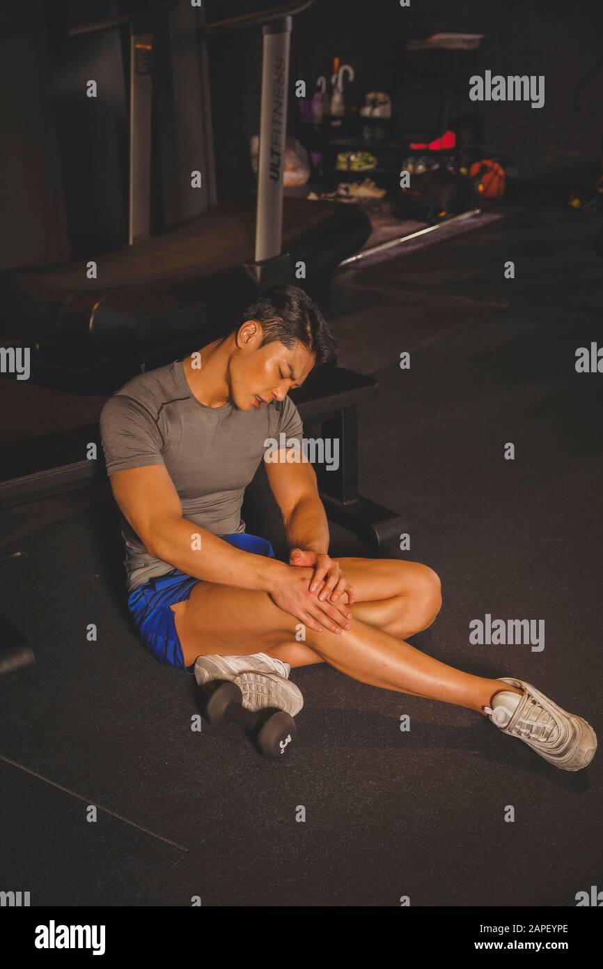 Male and female exercising in gym. Sport, fitness, weightlifting and ...