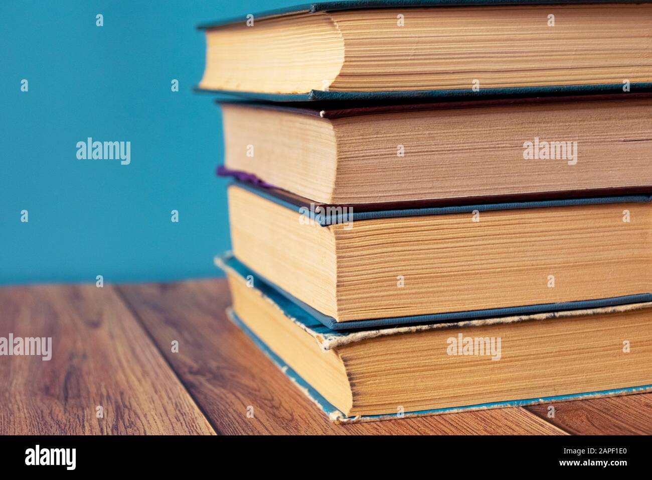 A stack of old books with yellow pages. Book binding. Knowledge and ...