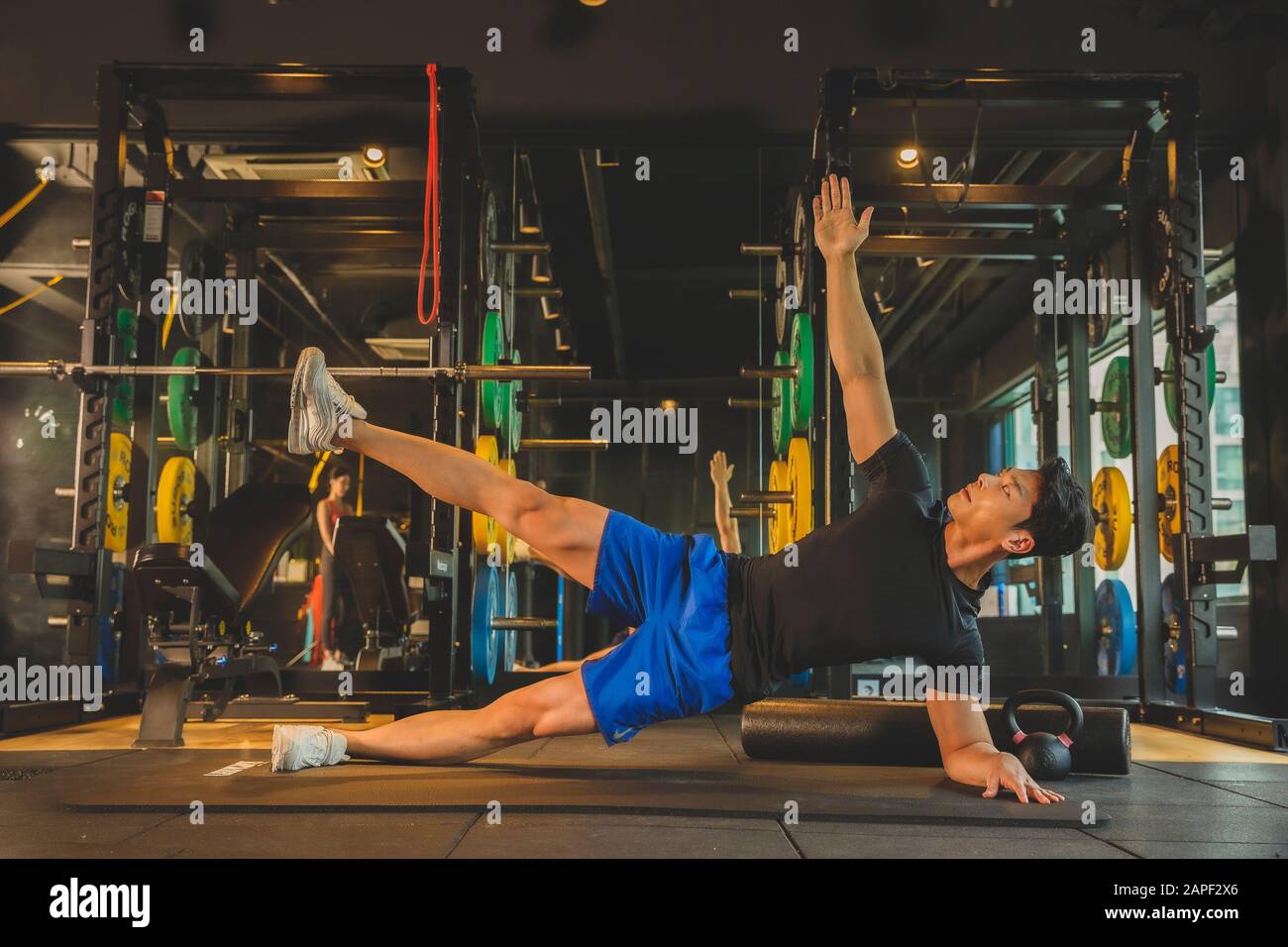 Male and female exercising in gym. Sport, fitness, weightlifting and ...