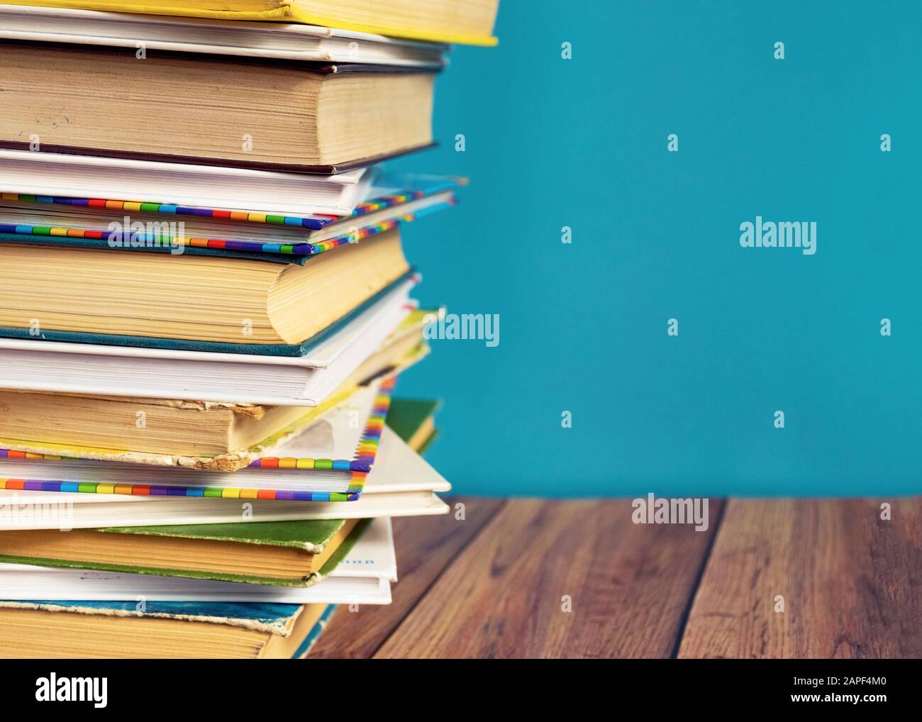 A stack of old books with yellow pages. Book binding. Knowledge and ...