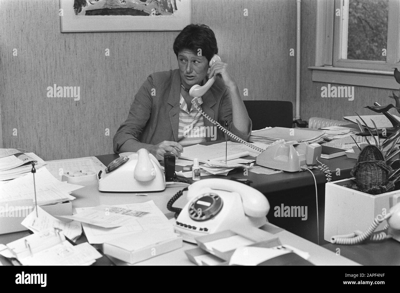 Mrs. Boosten from the AMRO bank behind her desk at the Herengracht 600 ...