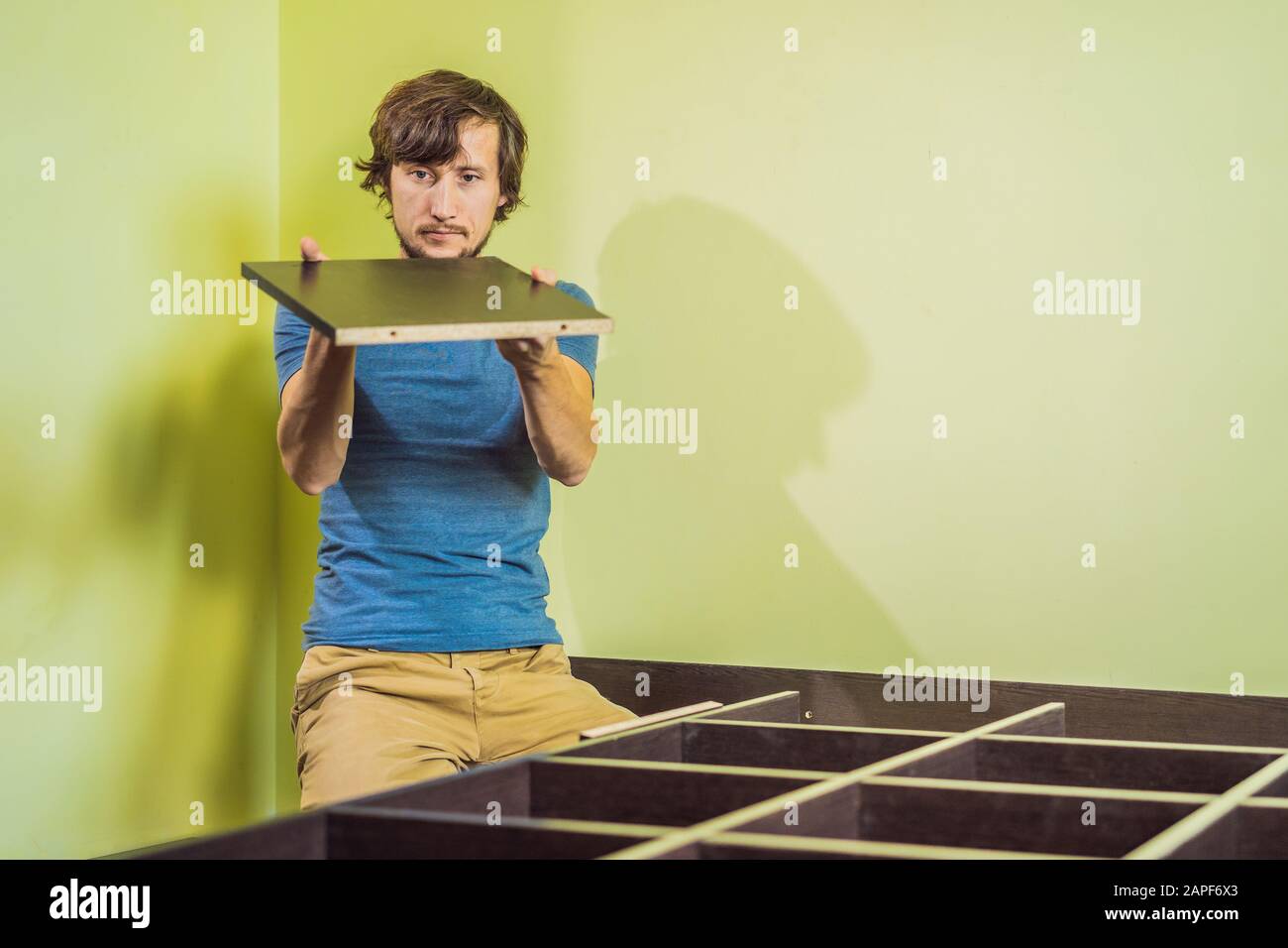 Frustrated Man Putting Together Self Assembly Furniture Stock Photo - Alamy