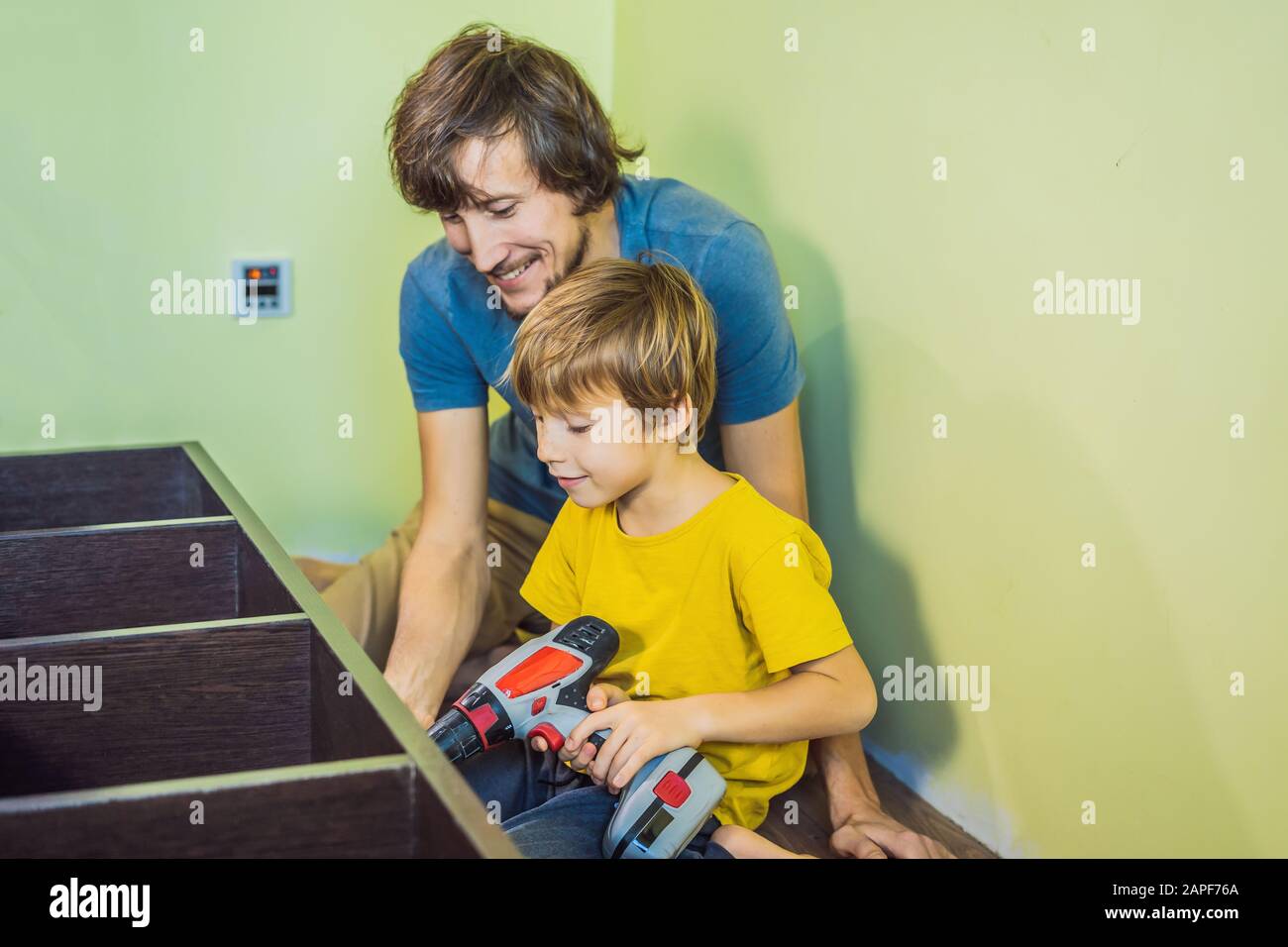 Father fixing toy son hi-res stock photography and images - Alamy