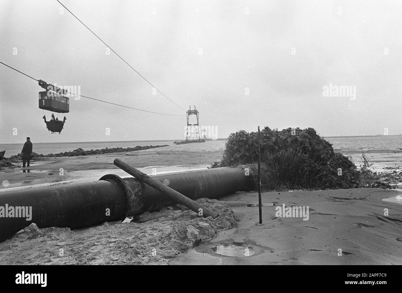 Construction Grevelingendam, large pipelines spraying sand behind the ...