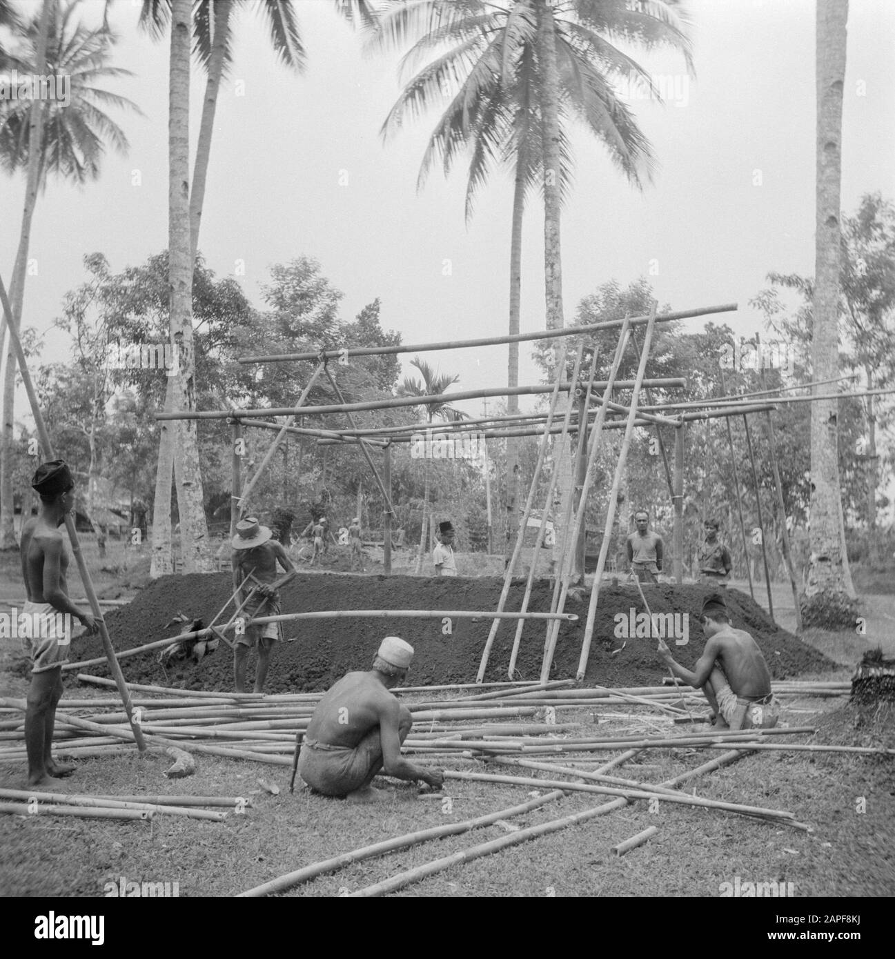 Journey to Indonesia Description: Building a frame of bamboo for a ...