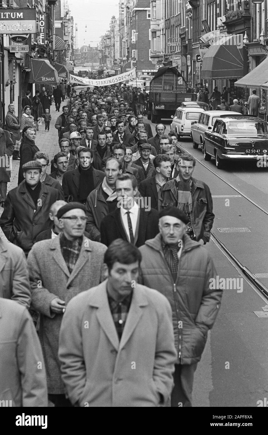Construction workers demonstrate, the procession pulls through downtown ...
