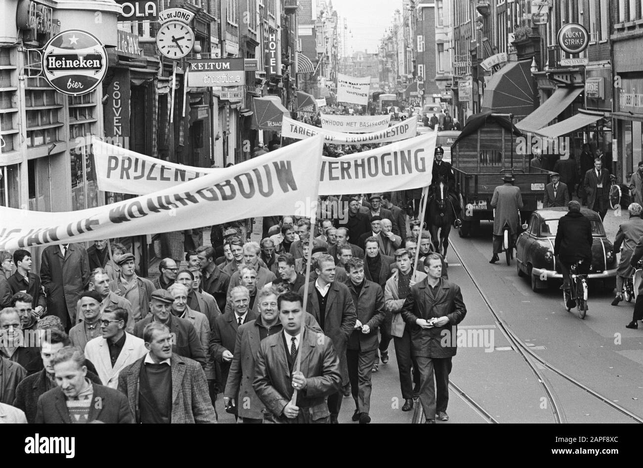 Construction workers demonstrate, the procession pulls through downtown ...