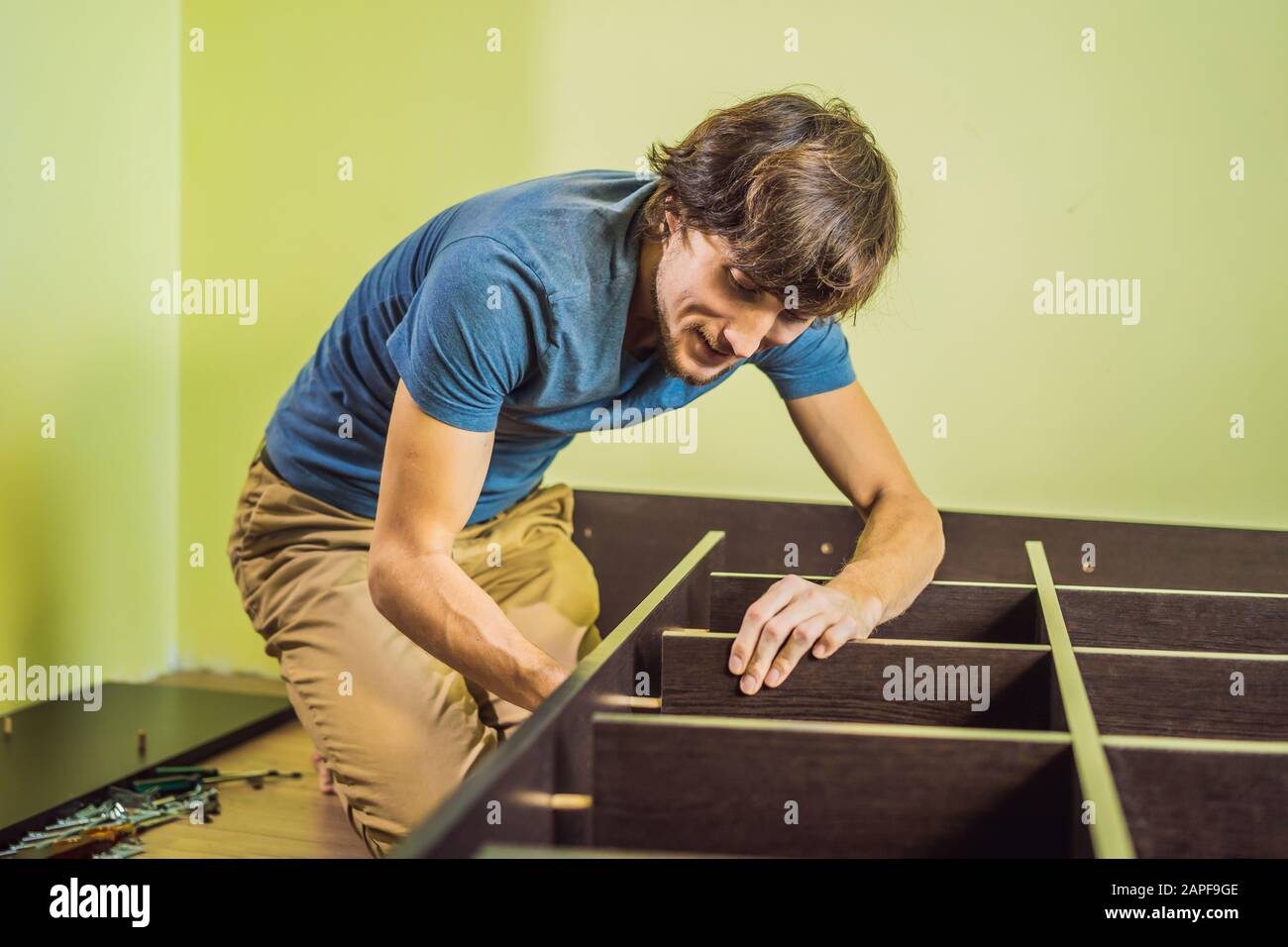 Frustrated Man Putting Together Self Assembly Furniture Stock Photo - Alamy