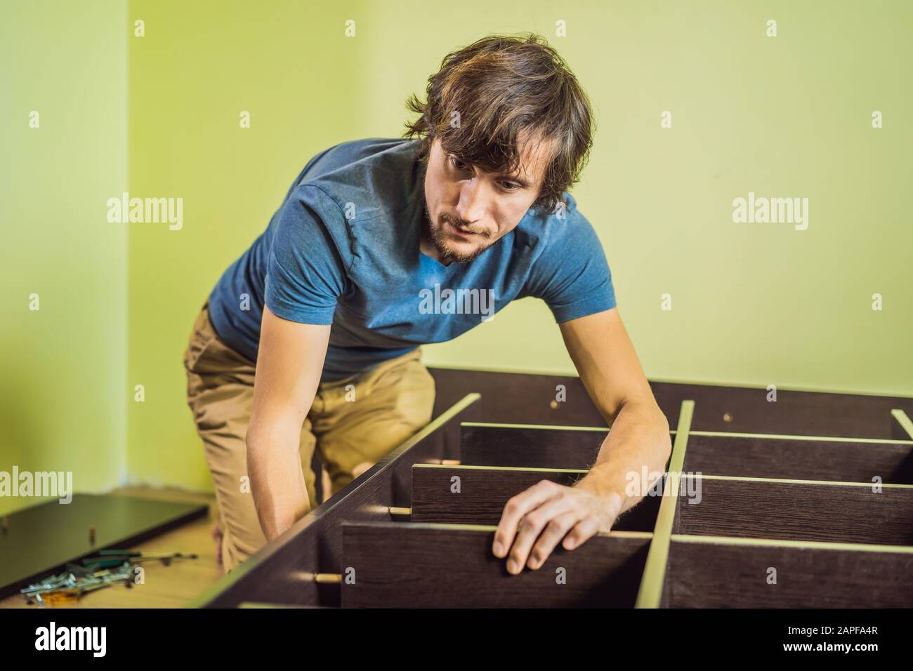 Frustrated Man Putting Together Self Assembly Furniture Stock Photo - Alamy