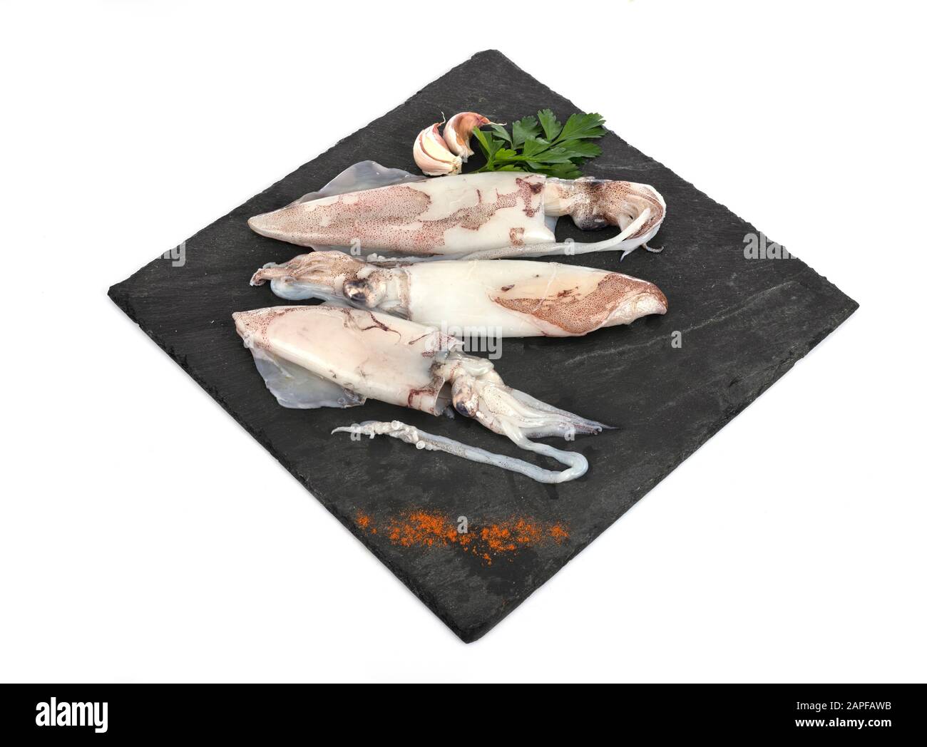 raw squid in front of white background Stock Photo - Alamy