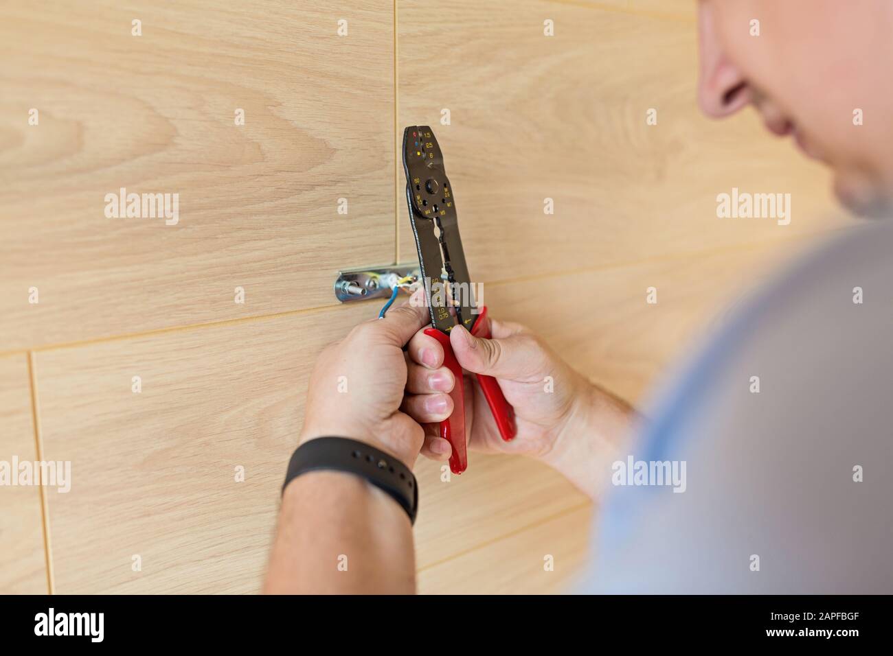 Man changes an electric light bulb. Concept of repair in bathroom ...