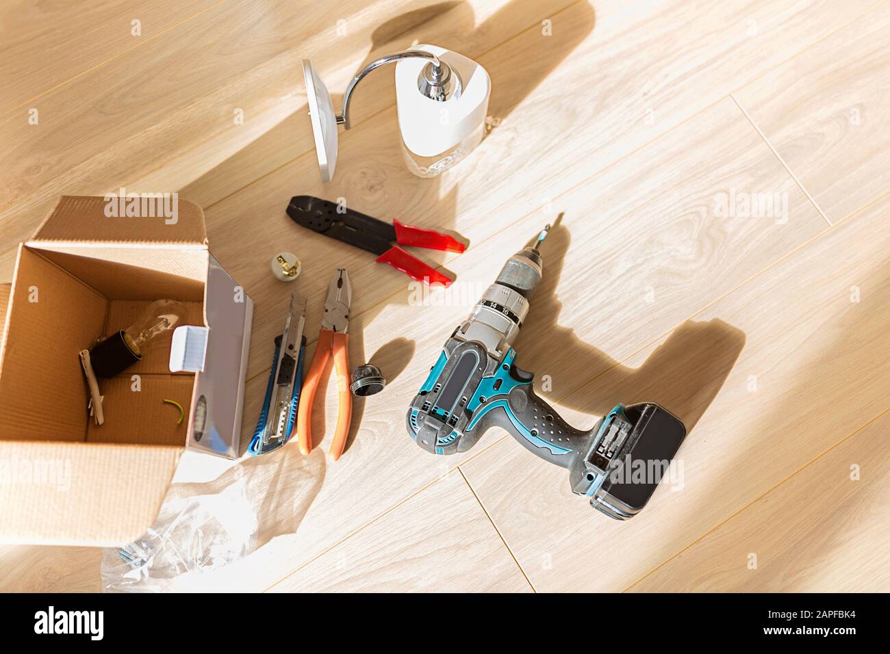 Tools for minor repairs on the wooden floor. DIY accessories ready to ...