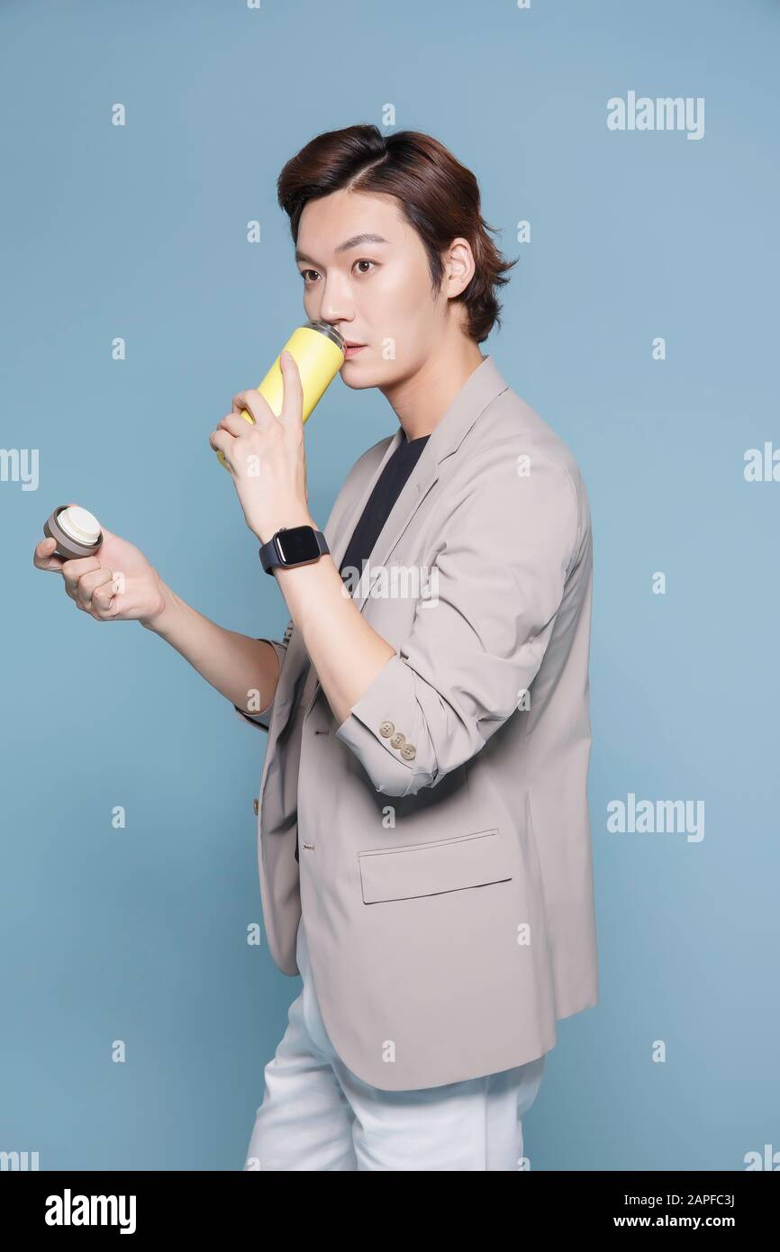 Close-up portrait of attractive young asian man, single man's lifestyle ...