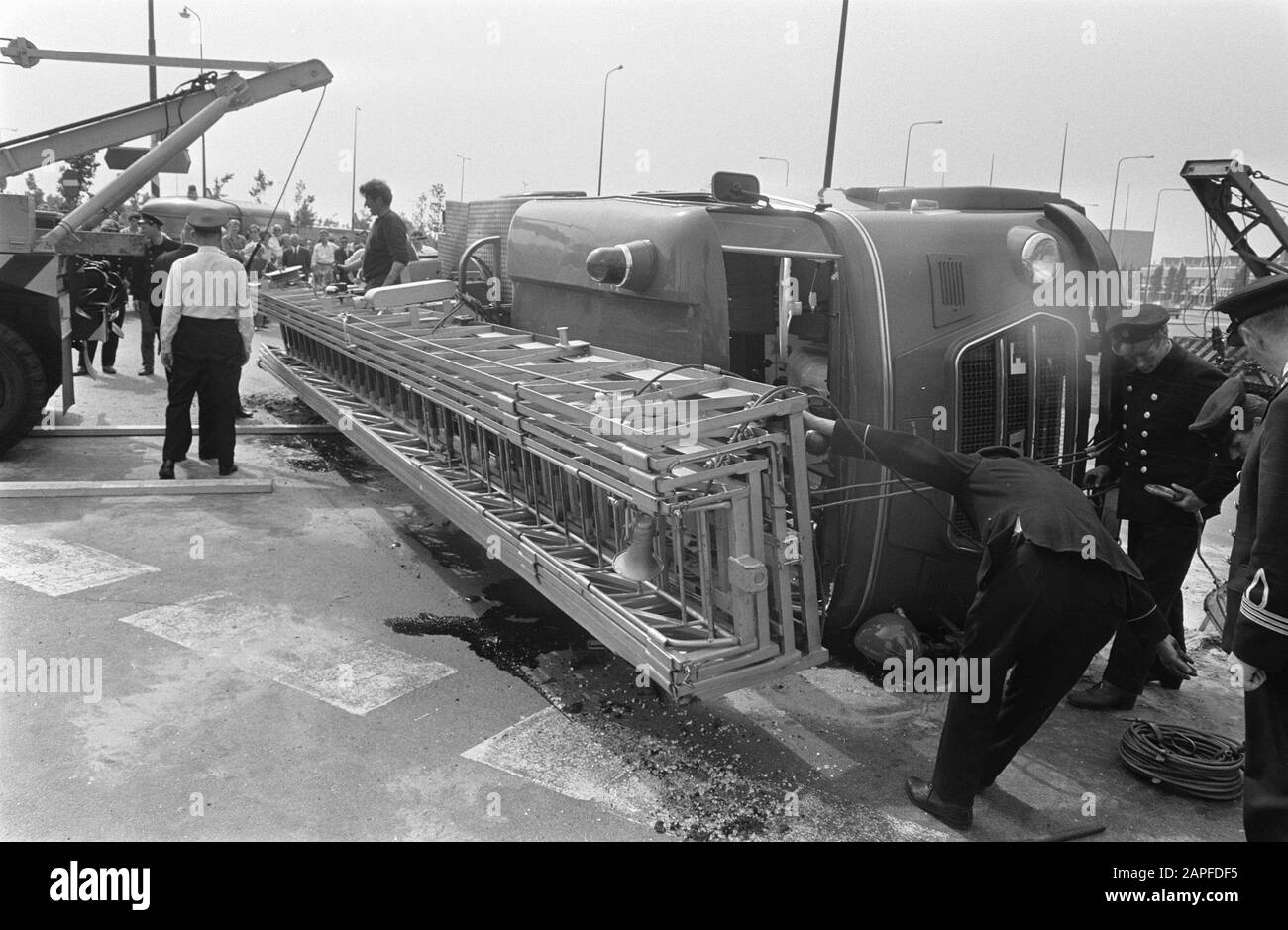 A fire brigade ladder car is turned over Description: fire brigade ...