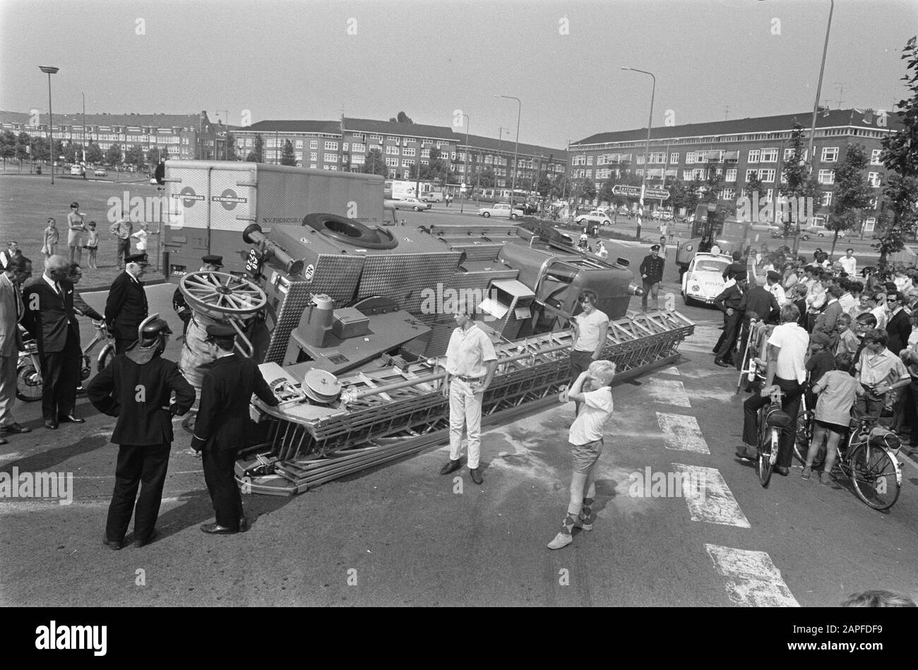 A fire brigade ladder car is turned over Description: fire brigade ...