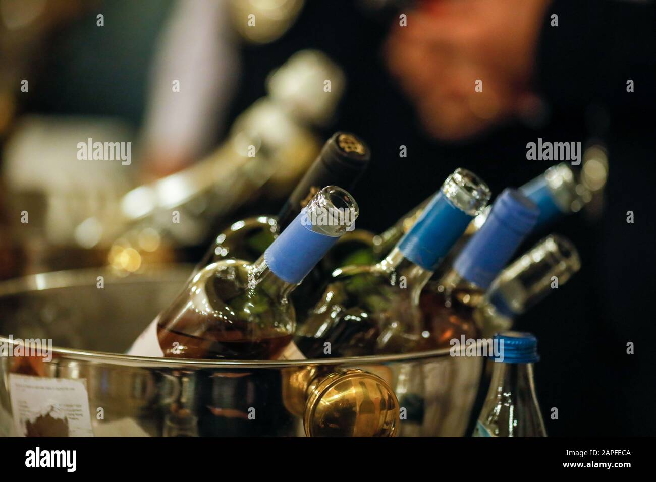 Details with wine bottles inside an ice bucket in a bar Stock Photo - Alamy