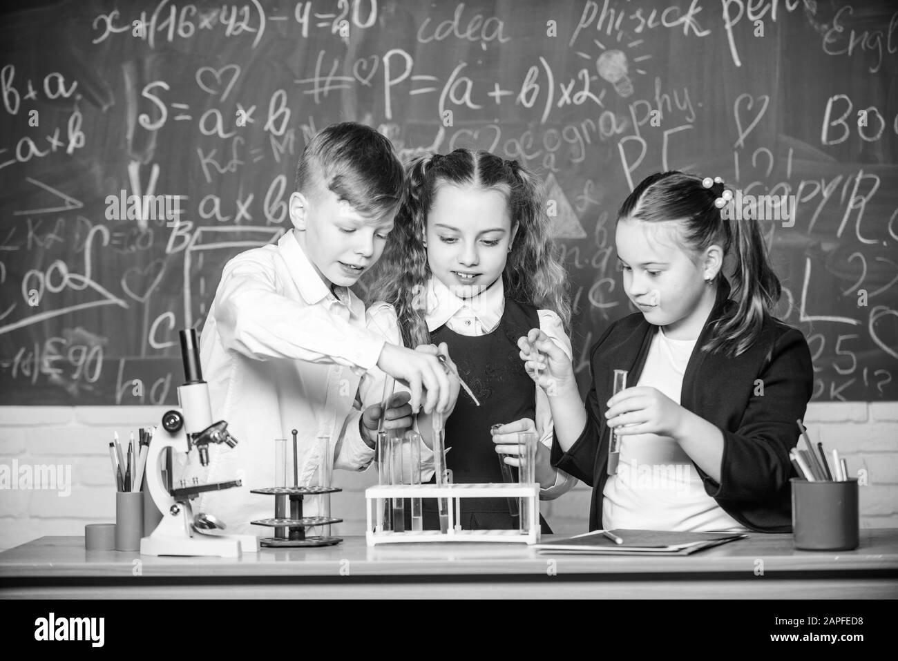Little children at school lesson. Little kids learning chemistry in ...