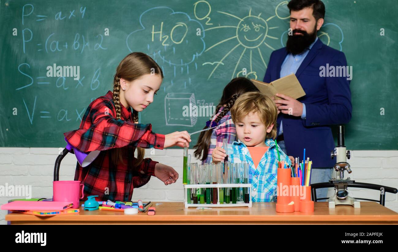 doing experiments with liquids in chemistry lab. chemistry lab. happy ...