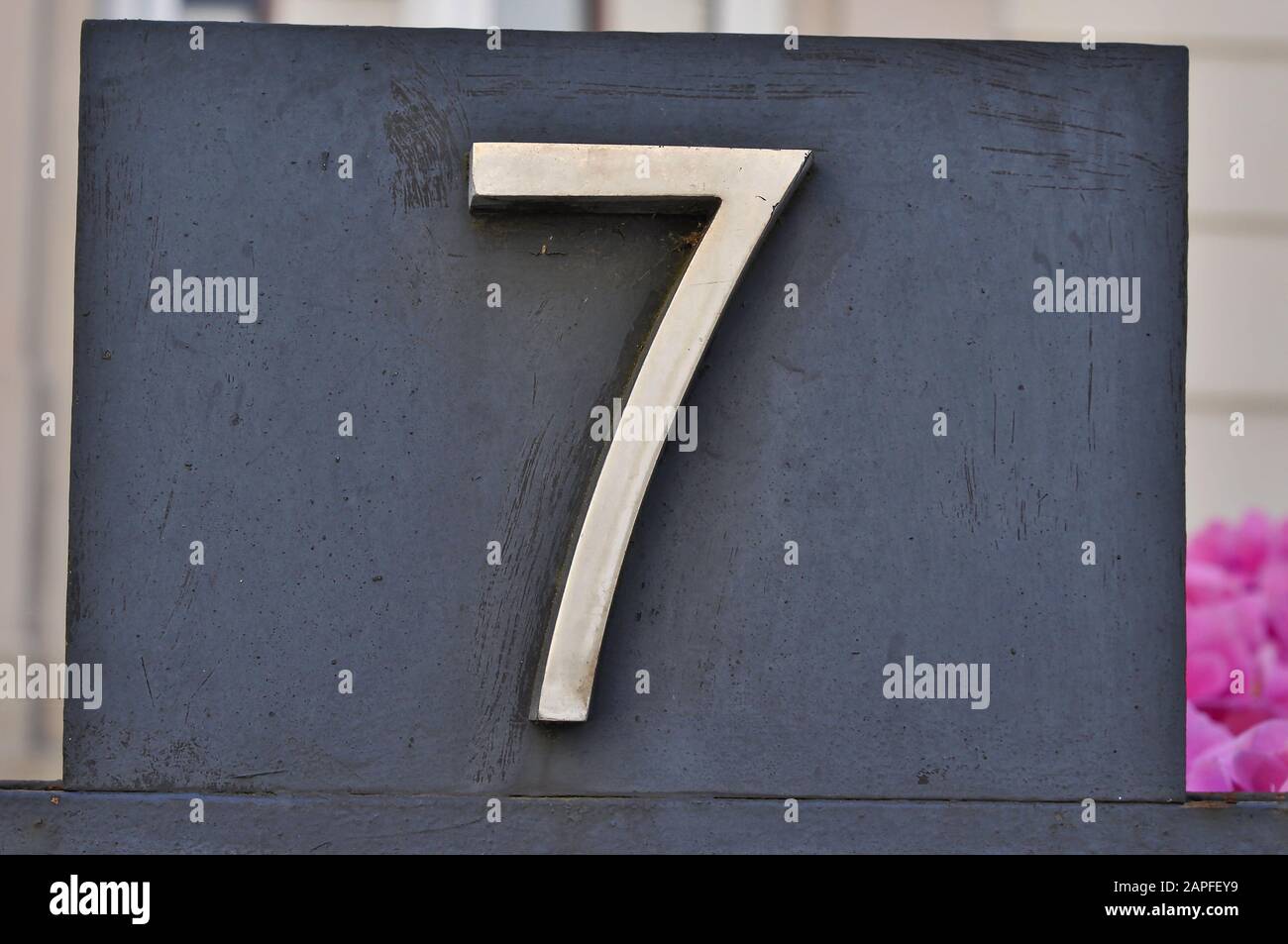 A house number plaque, showing the number seven (7 Stock Photo - Alamy
