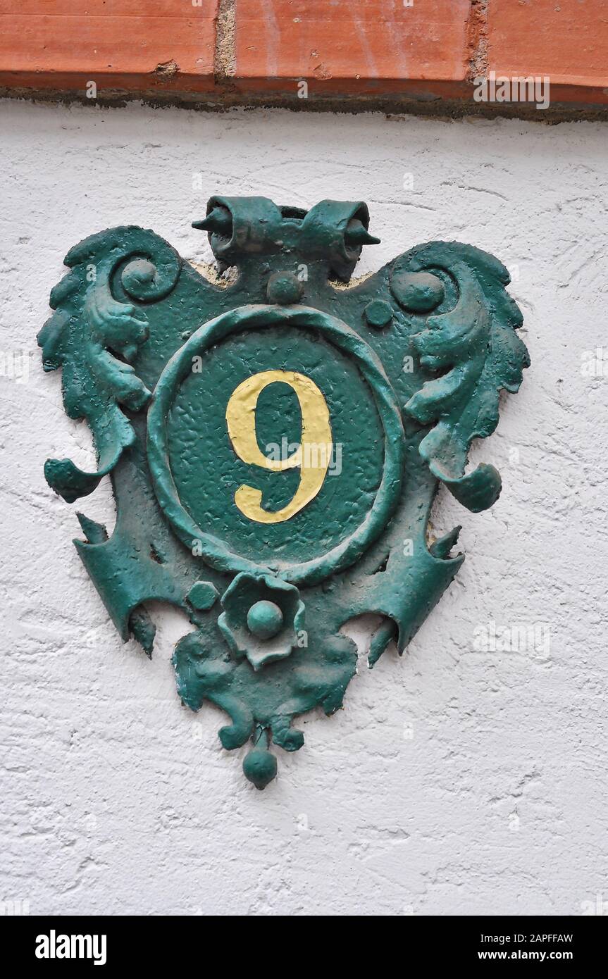 A house number plaque, showing the number nine (9 Stock Photo - Alamy