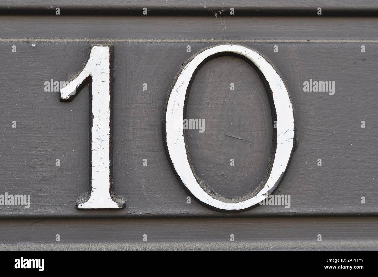 A house number plaque, showing the number ten (10 Stock Photo - Alamy