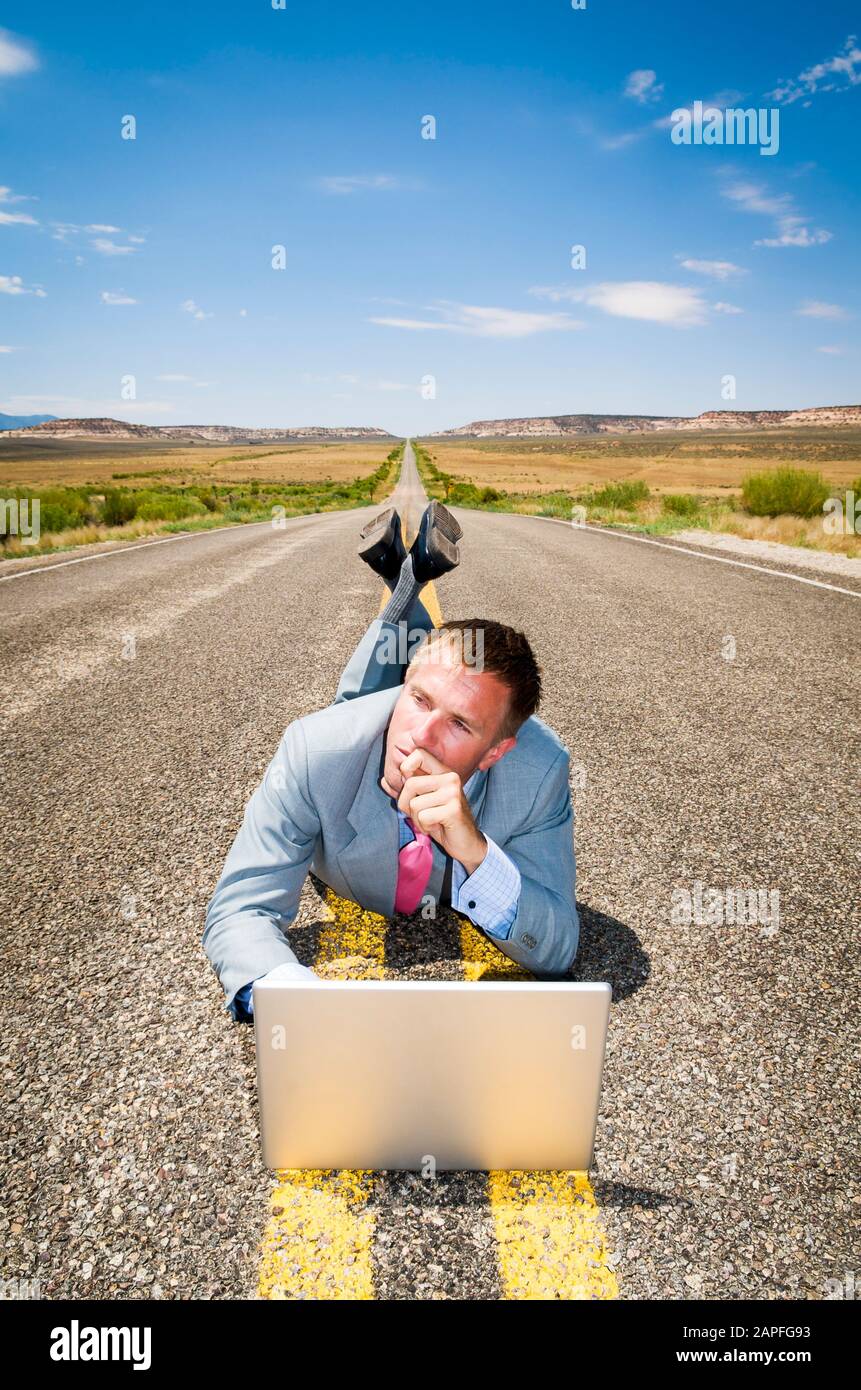 Man working on laptop desert hi-res stock photography and images - Alamy