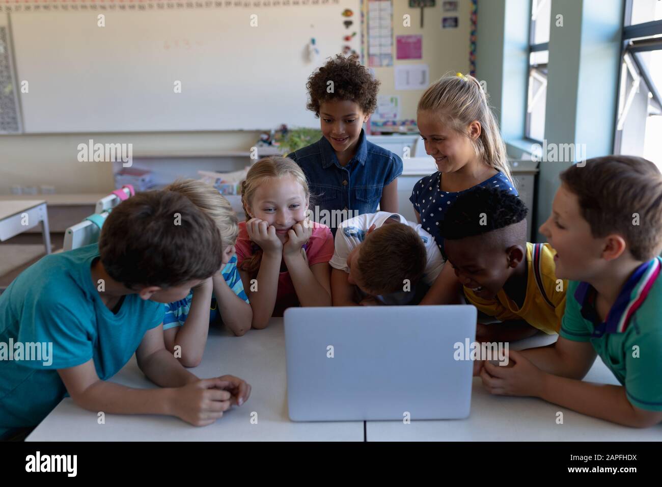 Boy laughing in a classroom hi-res stock photography and images - Alamy