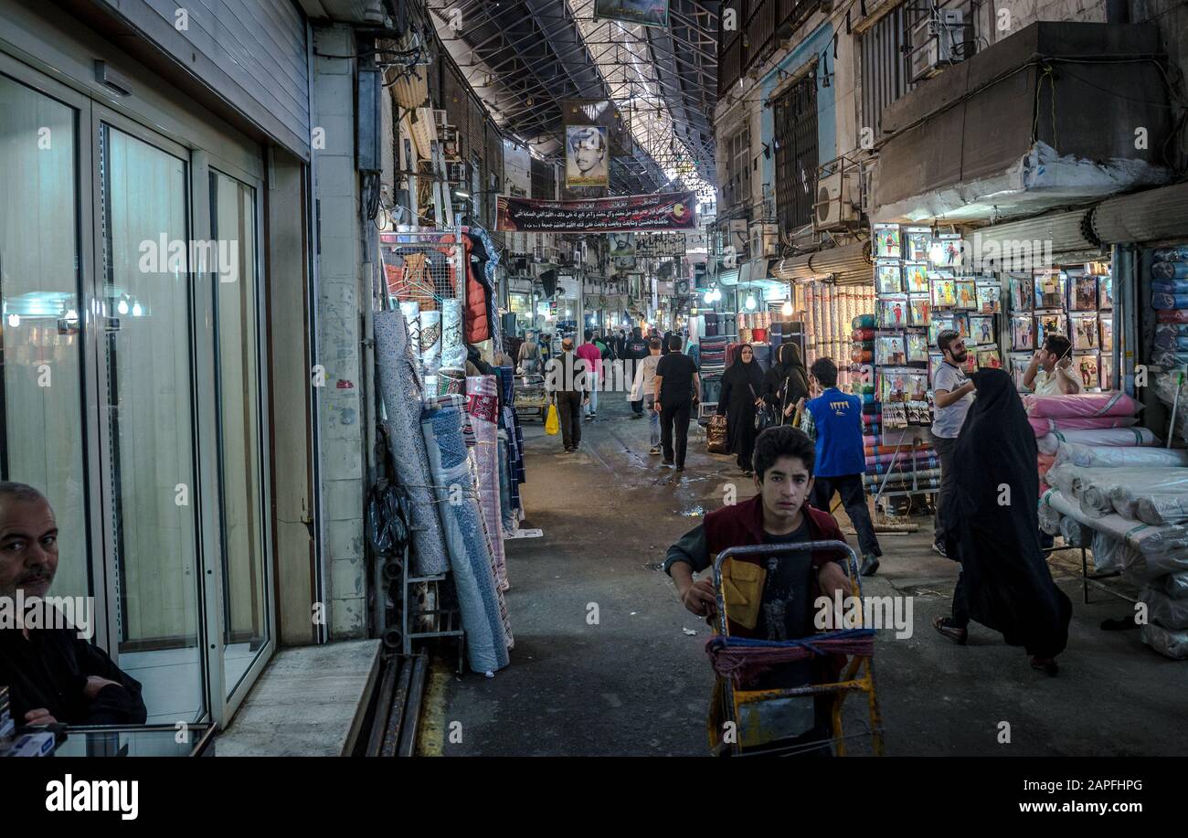 Alleyway full of shops with textiles for sale on the Grand Bazaar in ...
