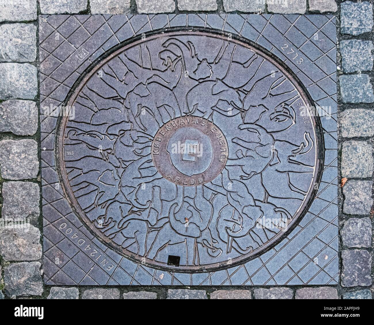 Manhole cover with design of 20 elephants designed by Peter Hentze ...