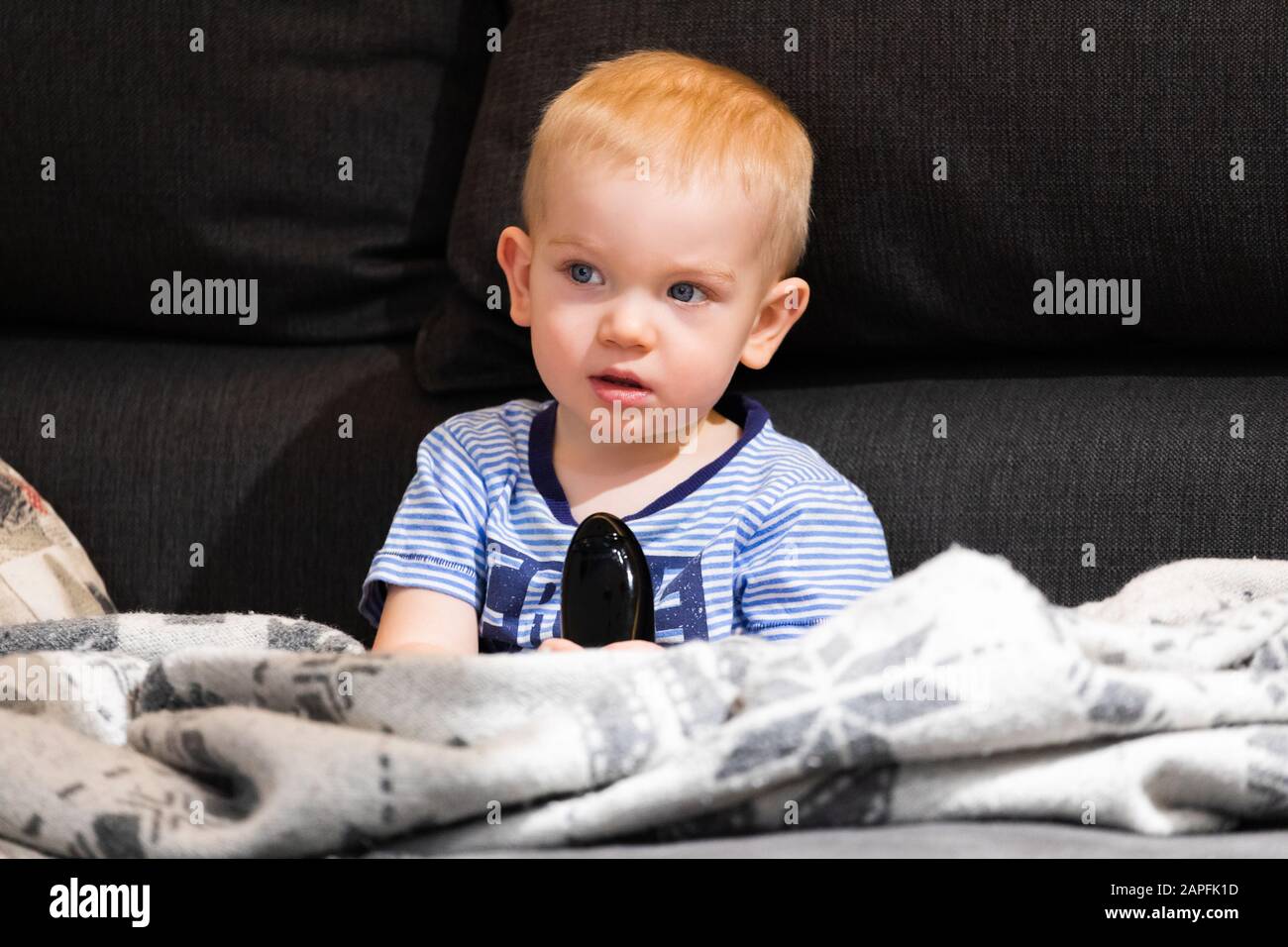 Little boy watching tv Stock Photo - Alamy