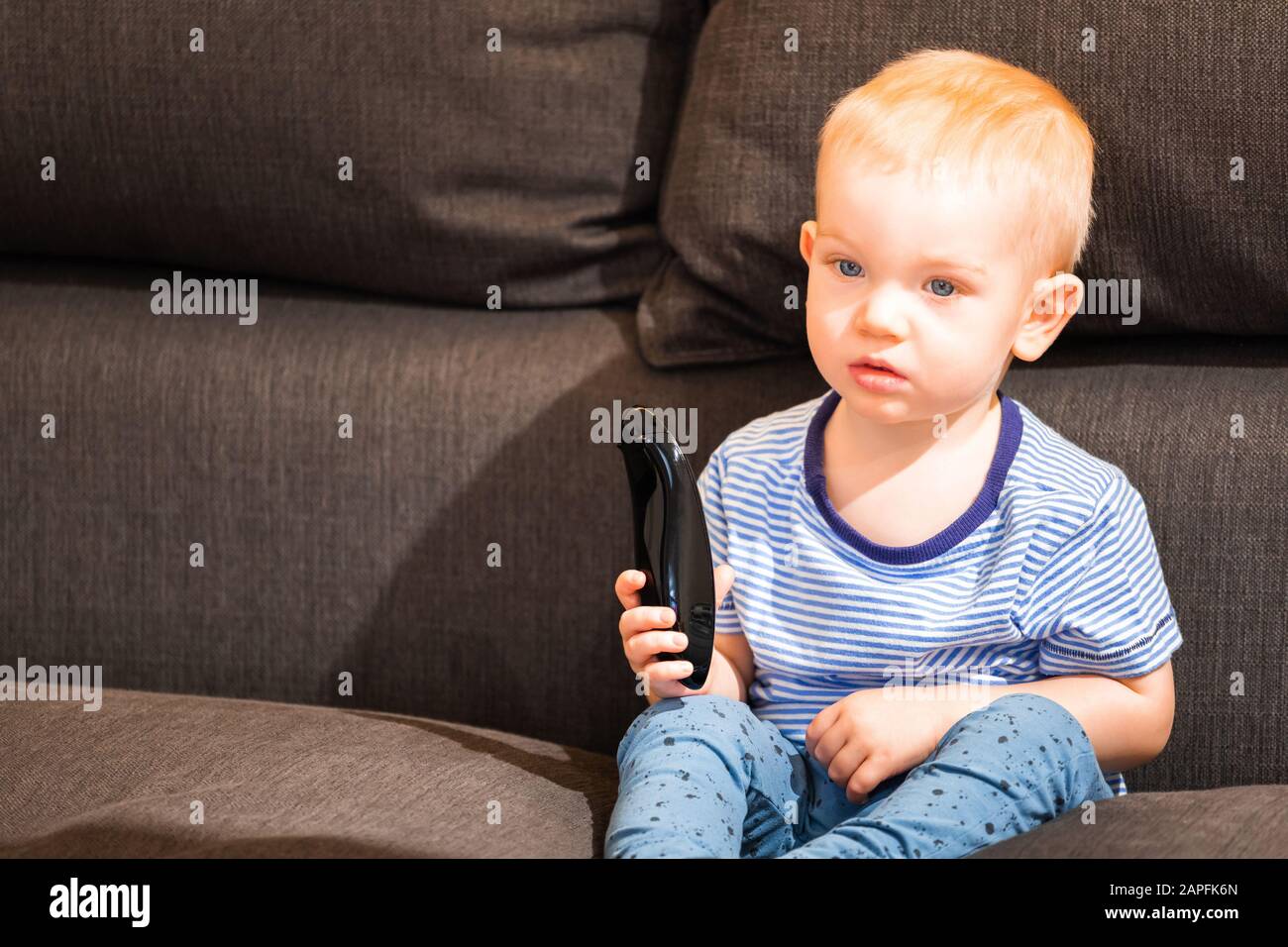 Little boy watching tv Stock Photo - Alamy