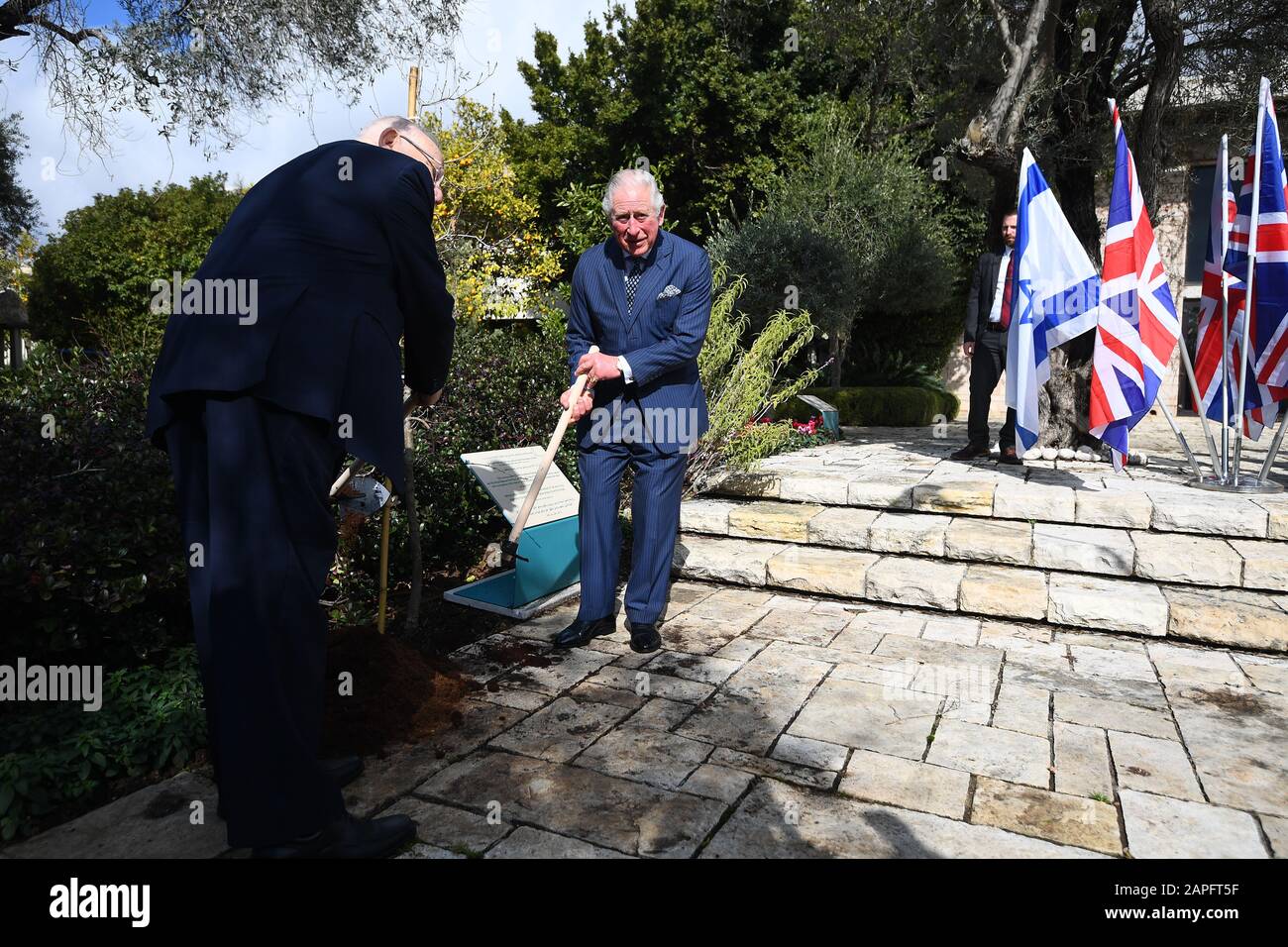 The Prince of Wales plants a tree after a meeting with President Reuven Rivlin (left) at his ...