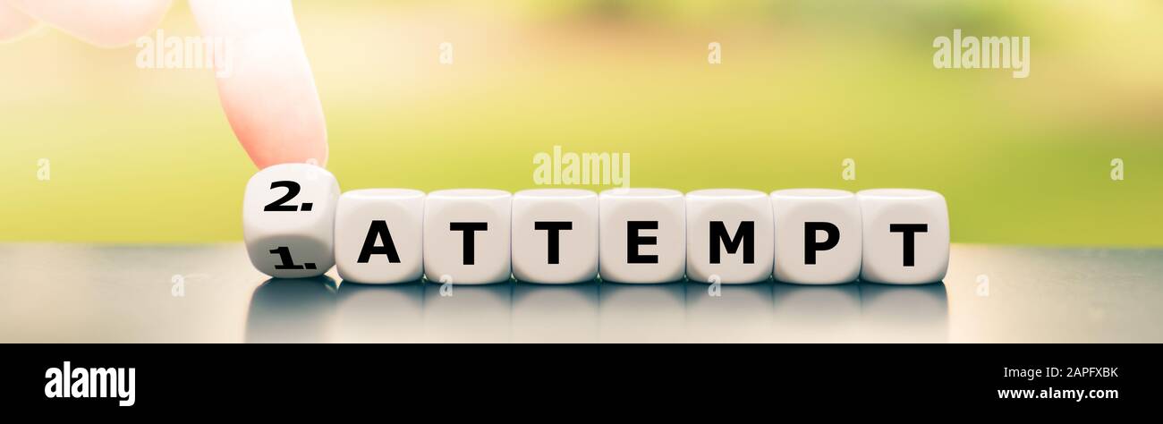 Hand turns a dice and changes the expression "1. attempt" to "2 ...