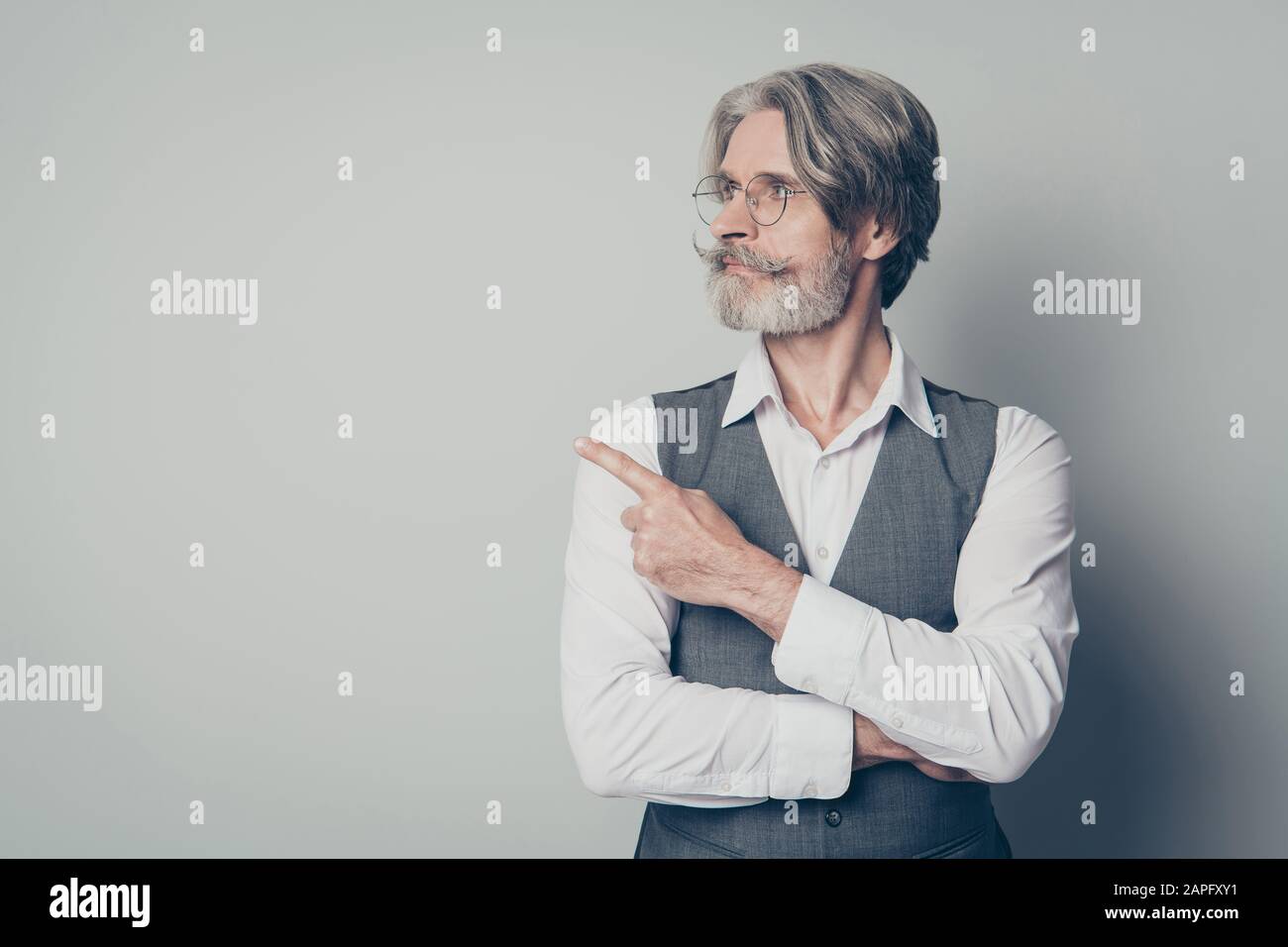 Portrait of confident cool old man promoter point index finger ...