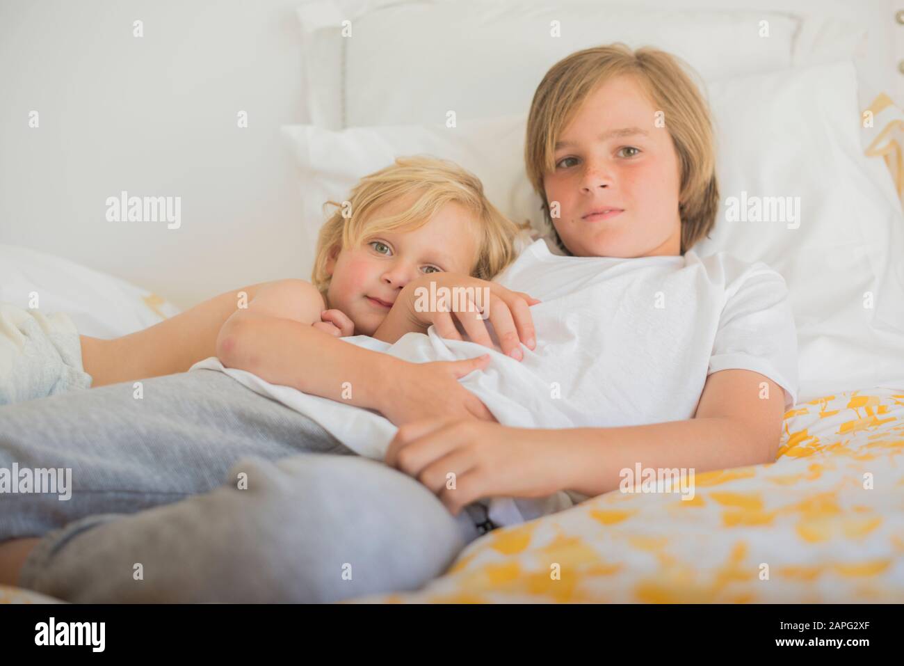 Brothers resting in bed Stock Photo - Alamy