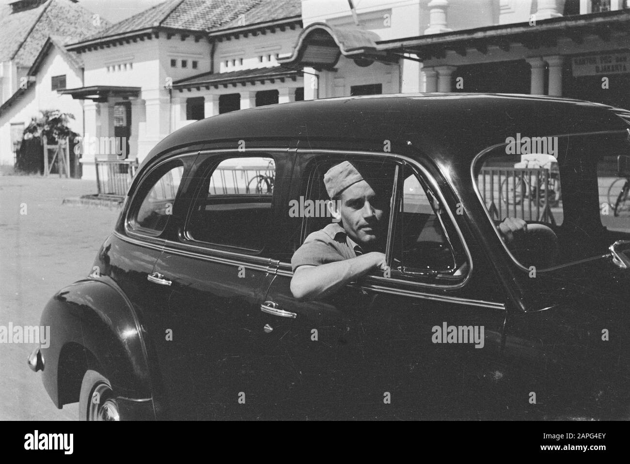 Post offices in Jakarta Description: Driver of car in front of the Post ...