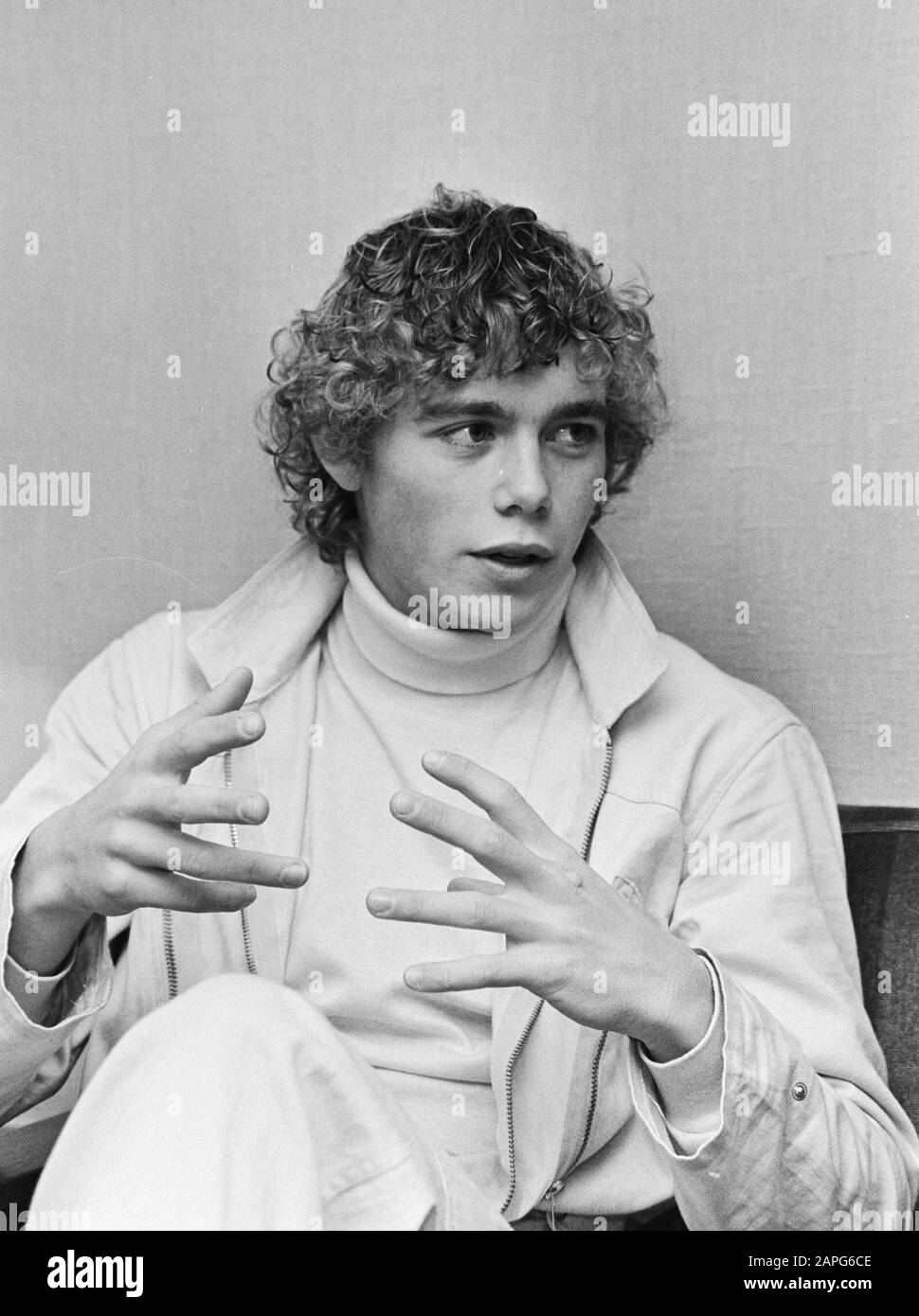 Actor Chris Atkins sitting on a couch during an interview Stock Photo ...