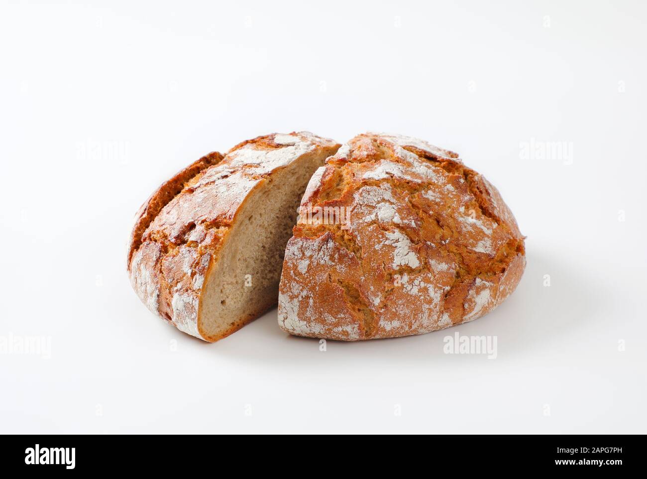 Loaf of rustic bread cut into halves Stock Photo - Alamy