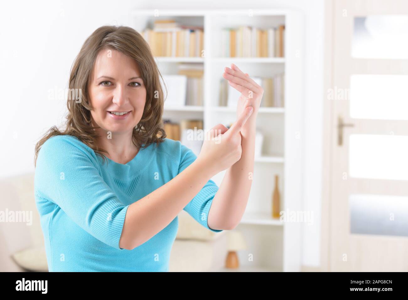 Woman doing EFT on the karate chop point. Emotional Freedom Techniques ...