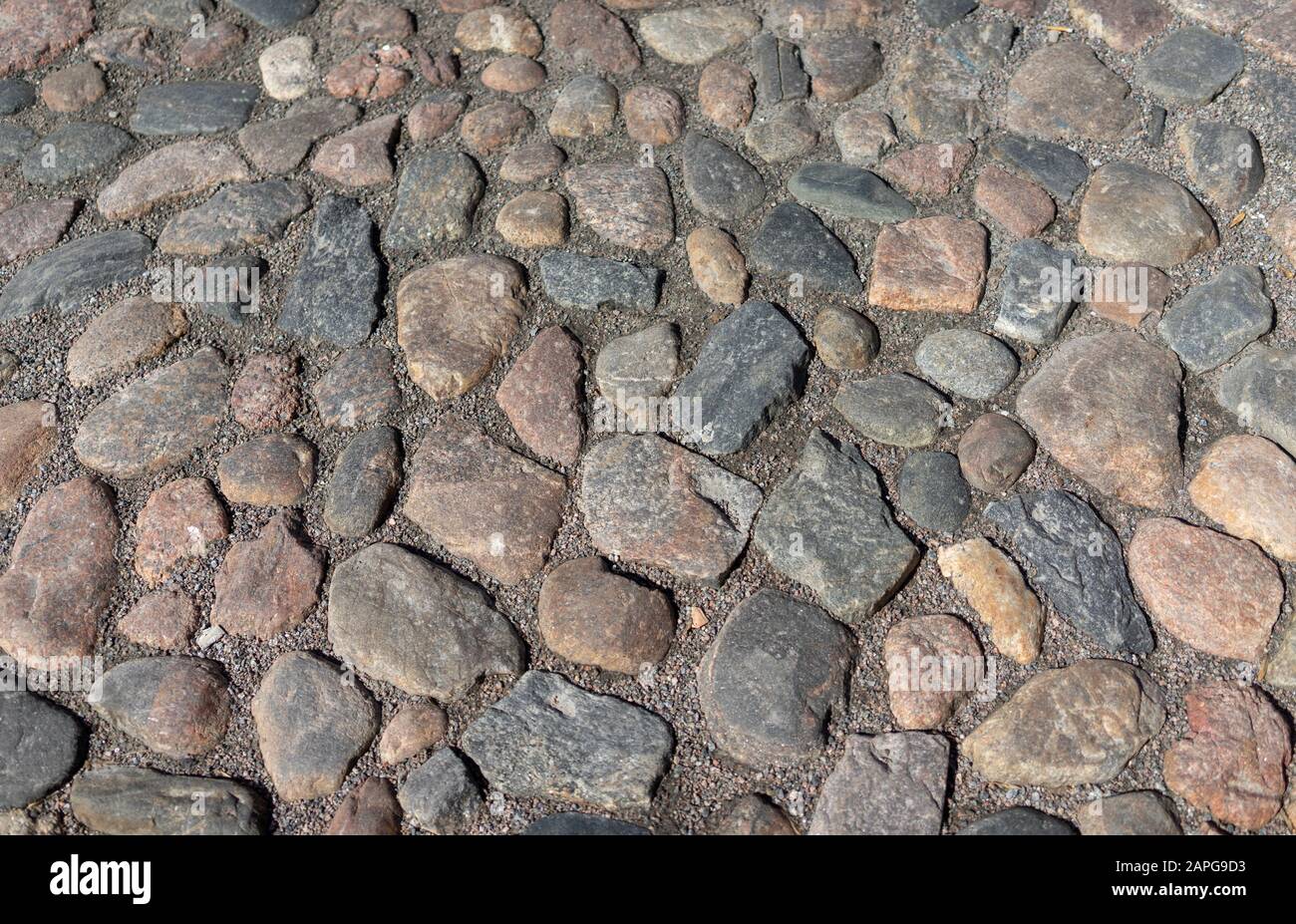 Old cobblestone pavement in the ancient European city Stock Photo - Alamy